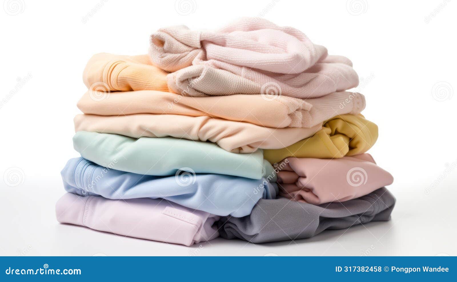 A Neatly Stacked Pile of Folded Clothes in Various Pastel Colors Stock ...