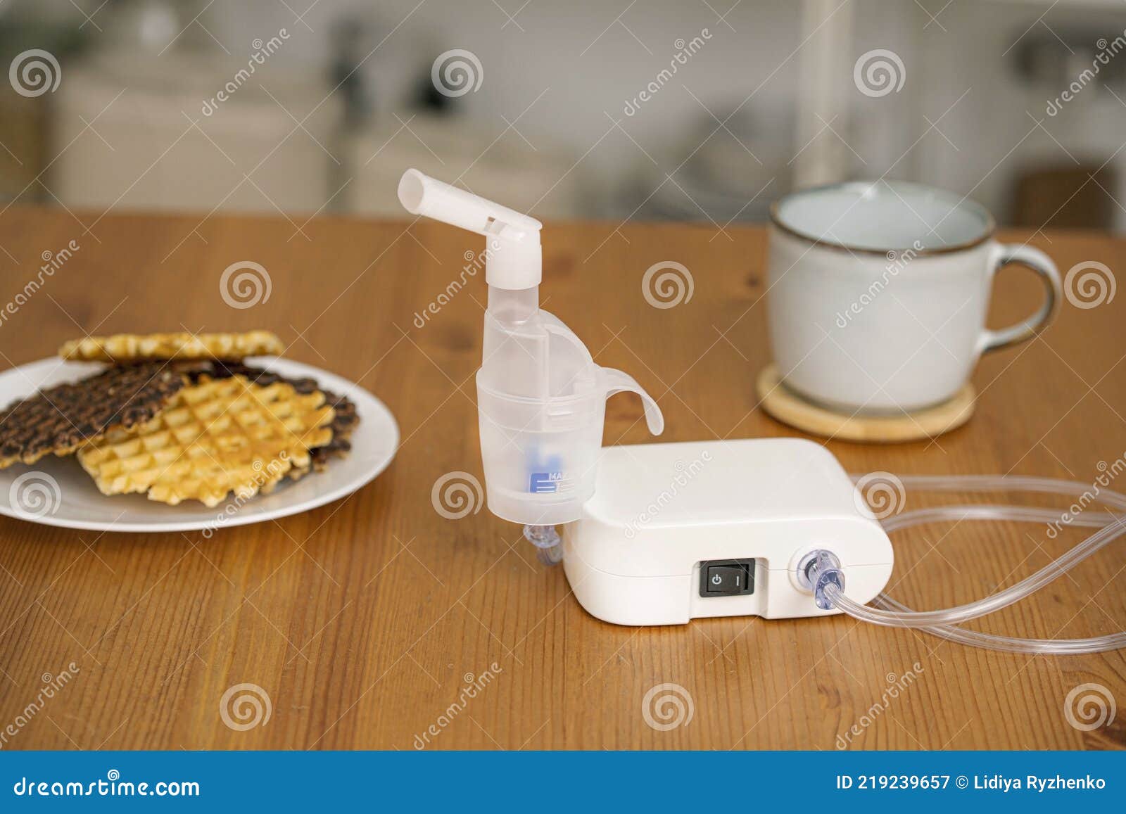 Nebulizer on the Table with a Cup and Cookies Stock Image - Image of ...