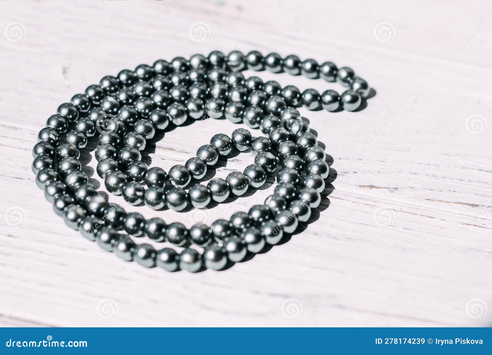 A Necklace of Gray Beads on a White Aesthetic Background Stock Image ...