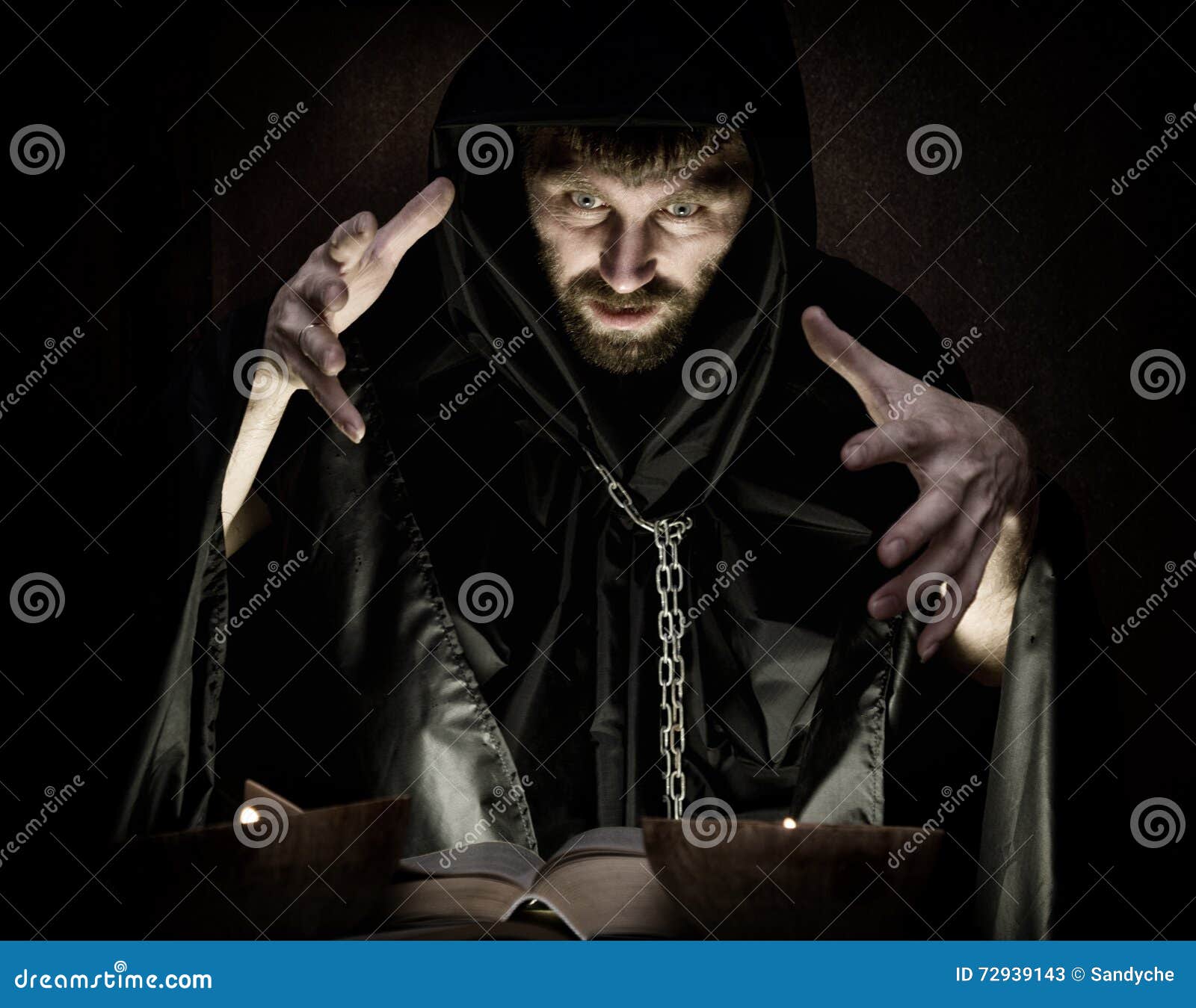 Necromancer Casts Spells From Thick Ancient Book By Candlelight On A ...