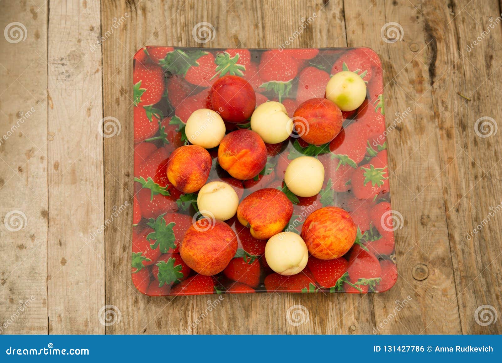 Nectarines of Different Varieties on a Plate with Strawberries Stock ...