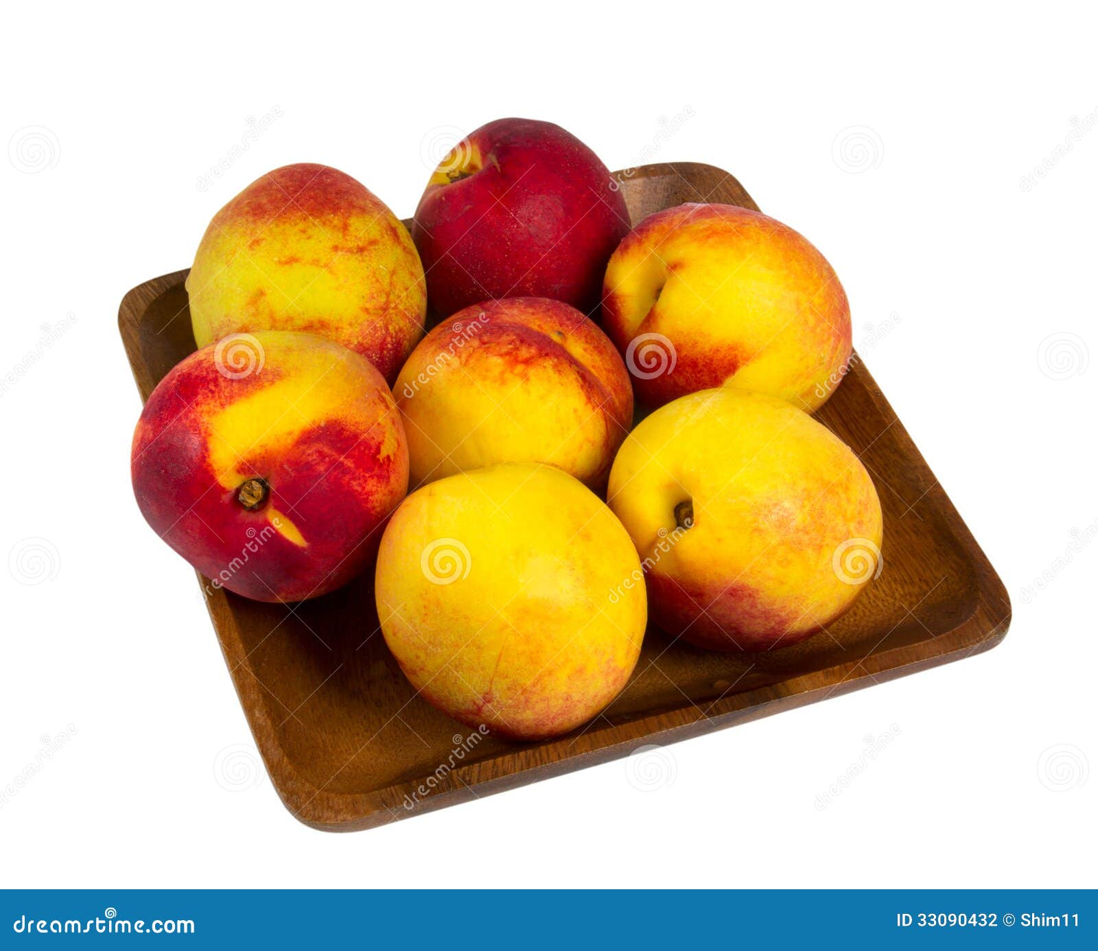 Nectarines in wooden plate stock photo. Image of bowl - 33090432