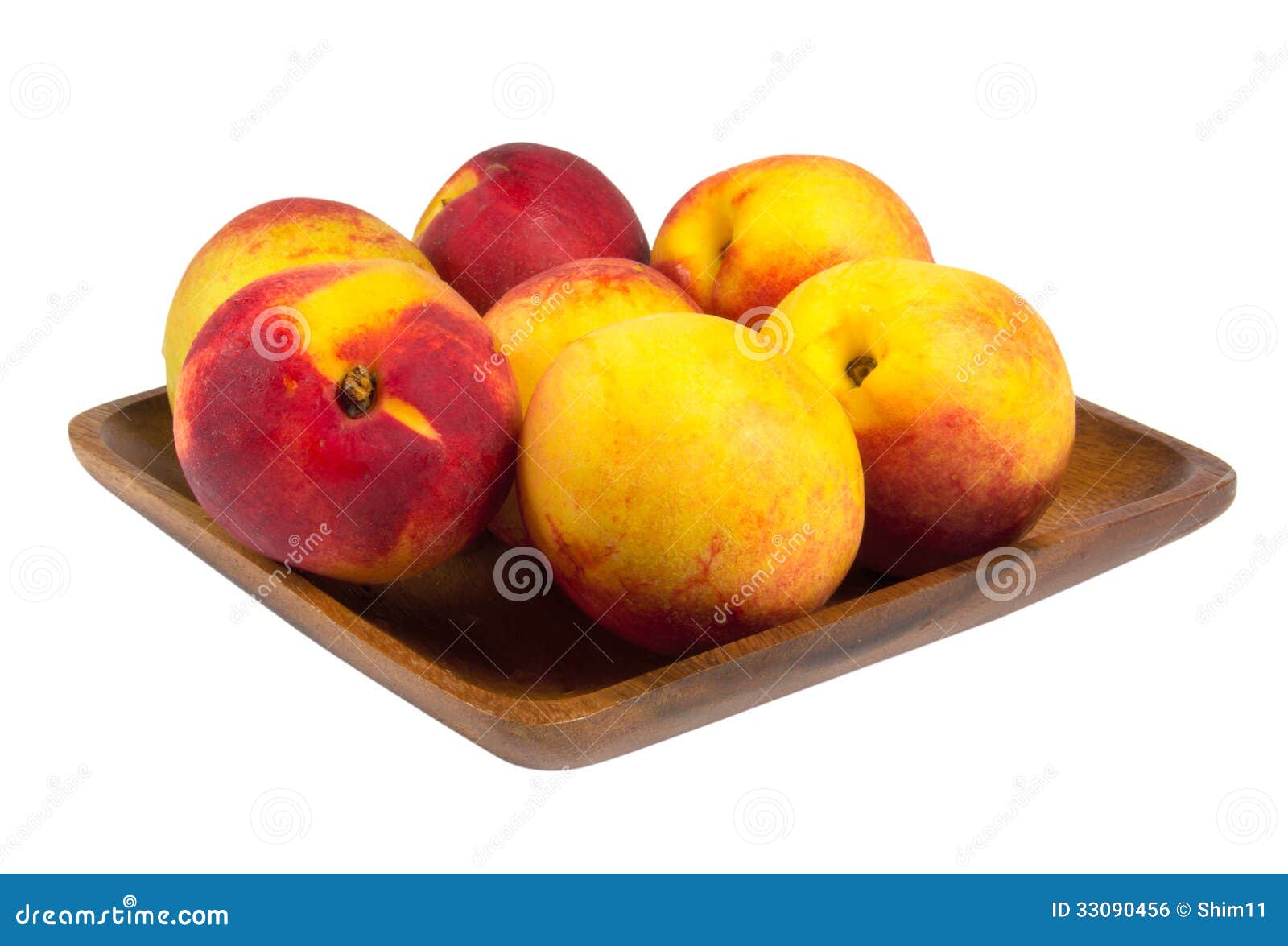 Nectarines in wooden plate stock photo. Image of snack - 33090456