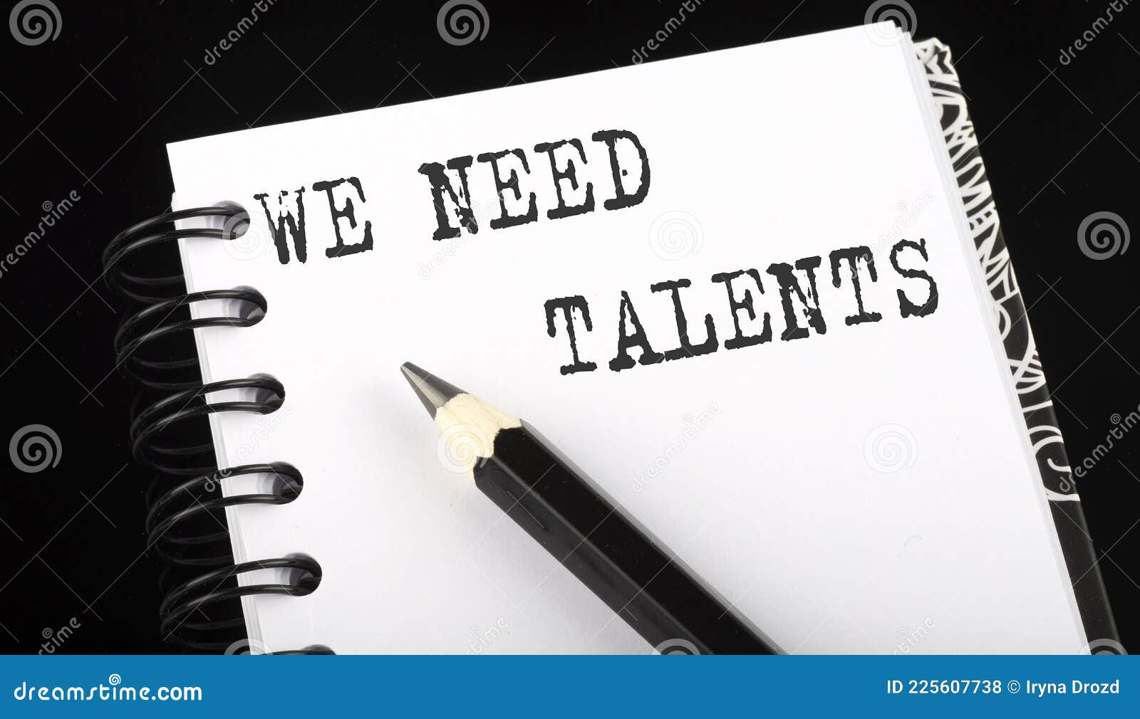 We NEED TALENTS Written Text in Small Notebook on a Black Background ...