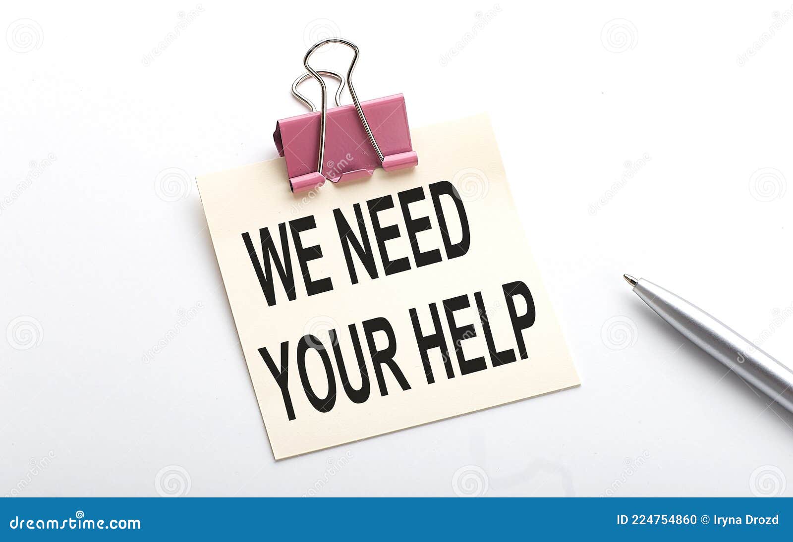 We NEED YOUR HELP Text on the Sticker with Pen on White Background ...