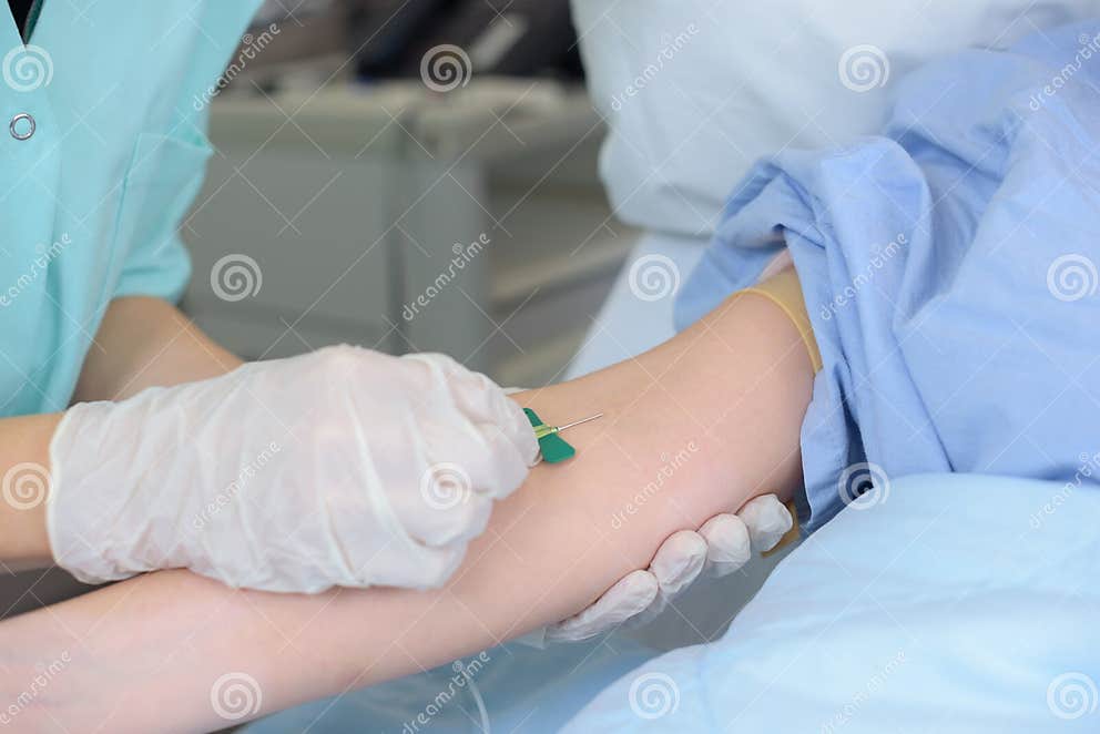 Needle Being Inserted into Patient S Arm Stock Photo - Image of clinic ...