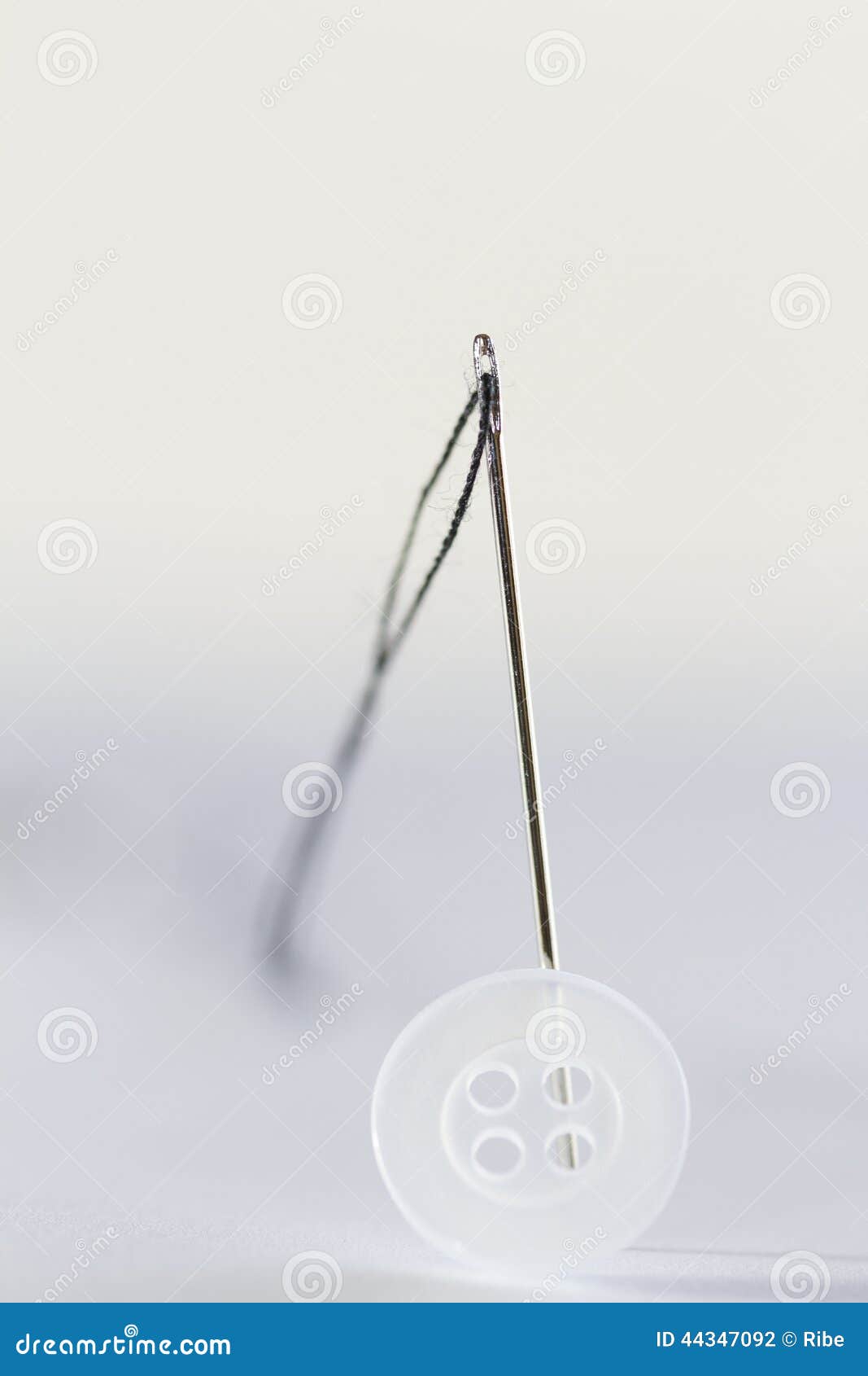 Needle, button and string stock photo. Image of blue - 44347092