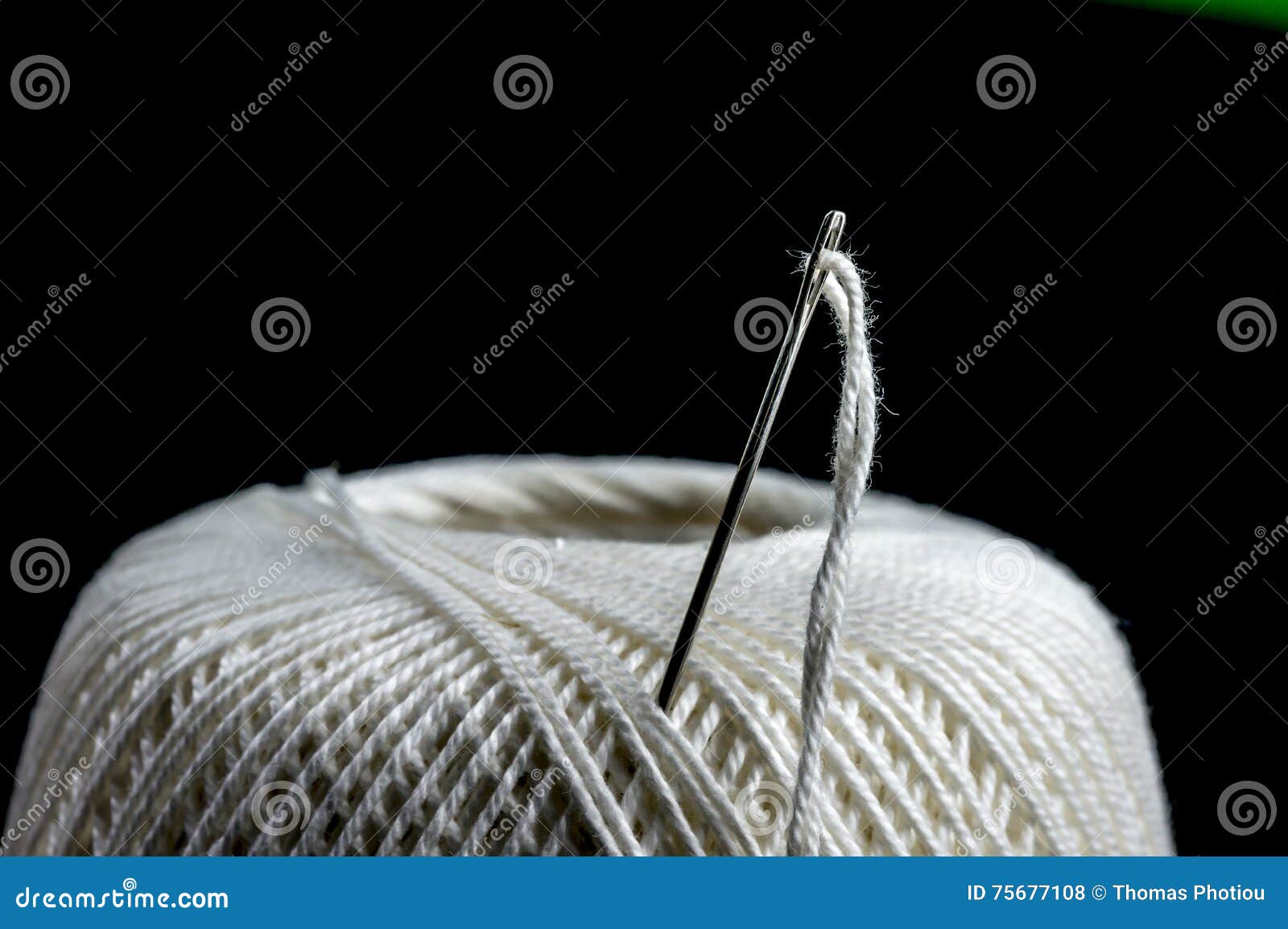 Needle on cotton thread stock photo. Image of metal, shot - 75677108