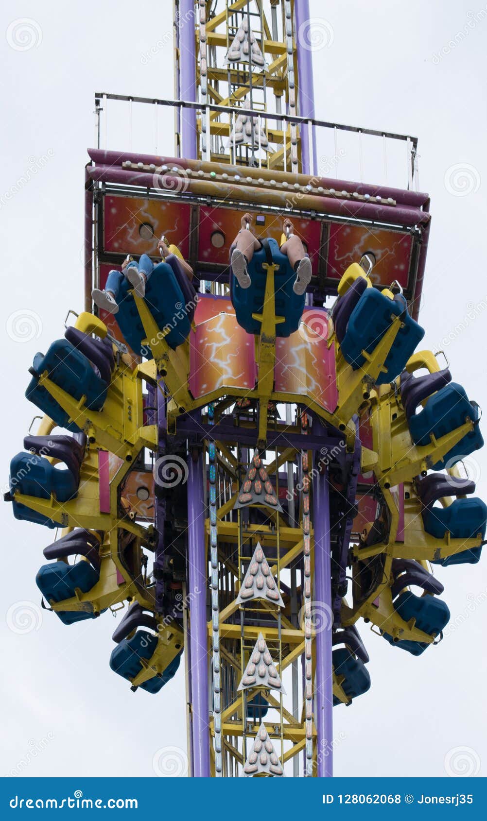 Four Feet Dangle from the Needle Drop Sky Ride at the State Fair the ...