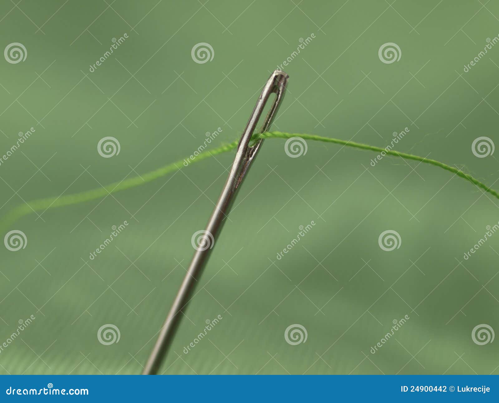 Needle with green thread stock photo. Image of instrument - 24900442