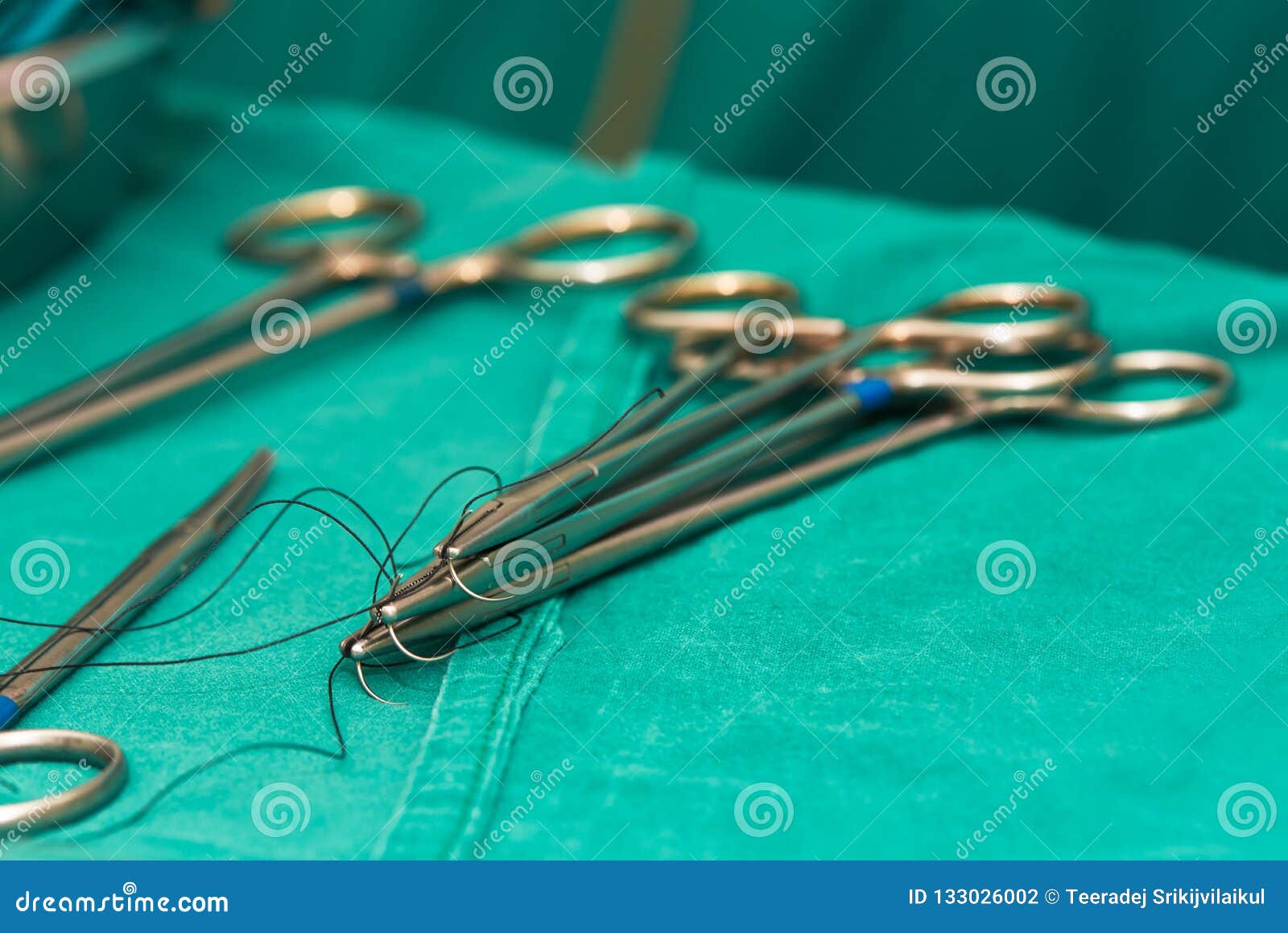 Needle Holders with Needles and Surgical Instruments on Operating Table ...