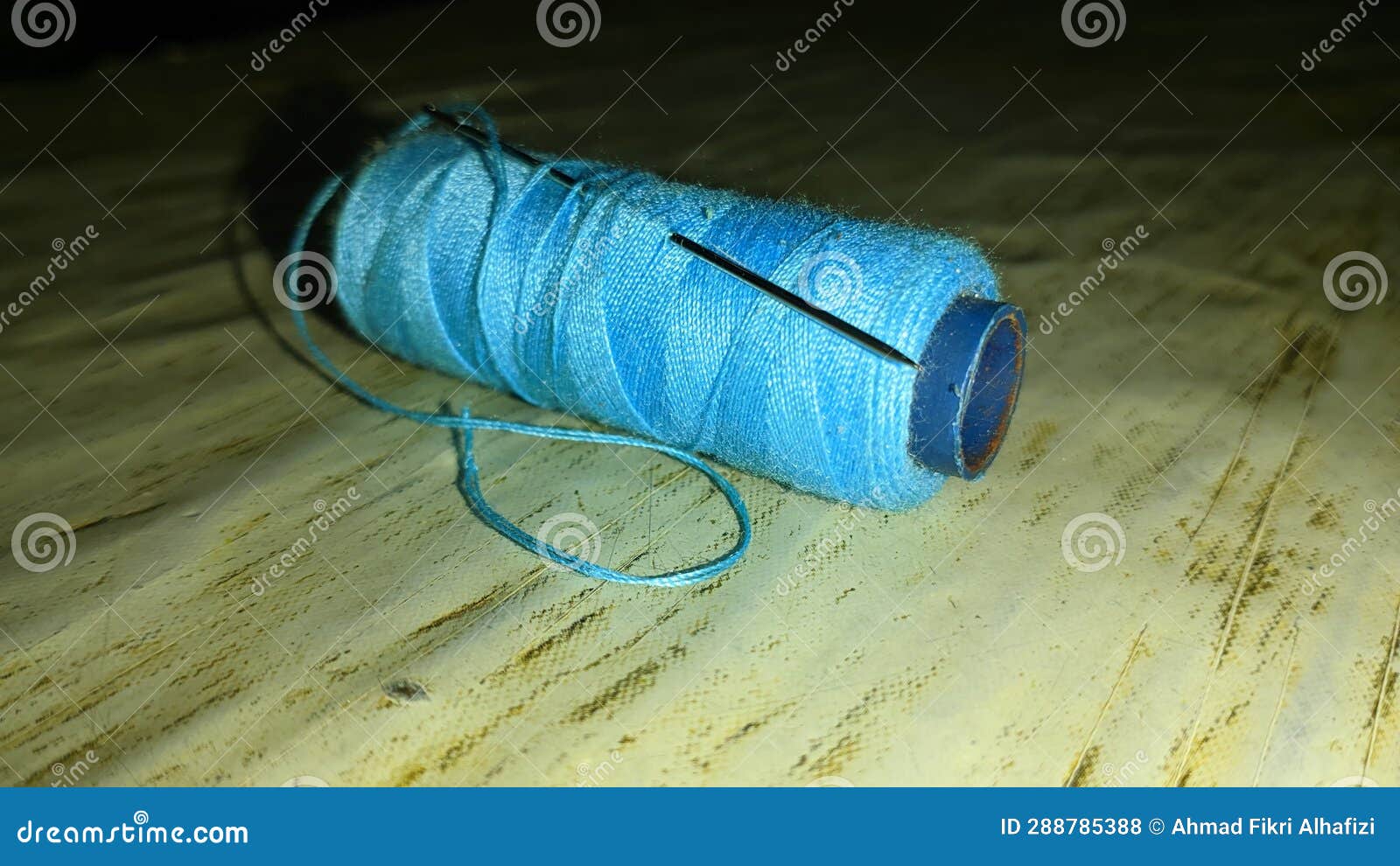The Needle is in the Middle of the Ball of Thread 1 Stock Photo - Image ...