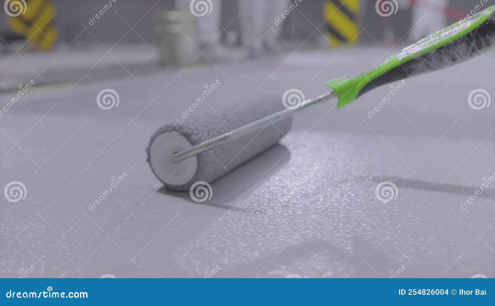 Creation of Self-leveling Floors. the Builder Works with a Spiked ...