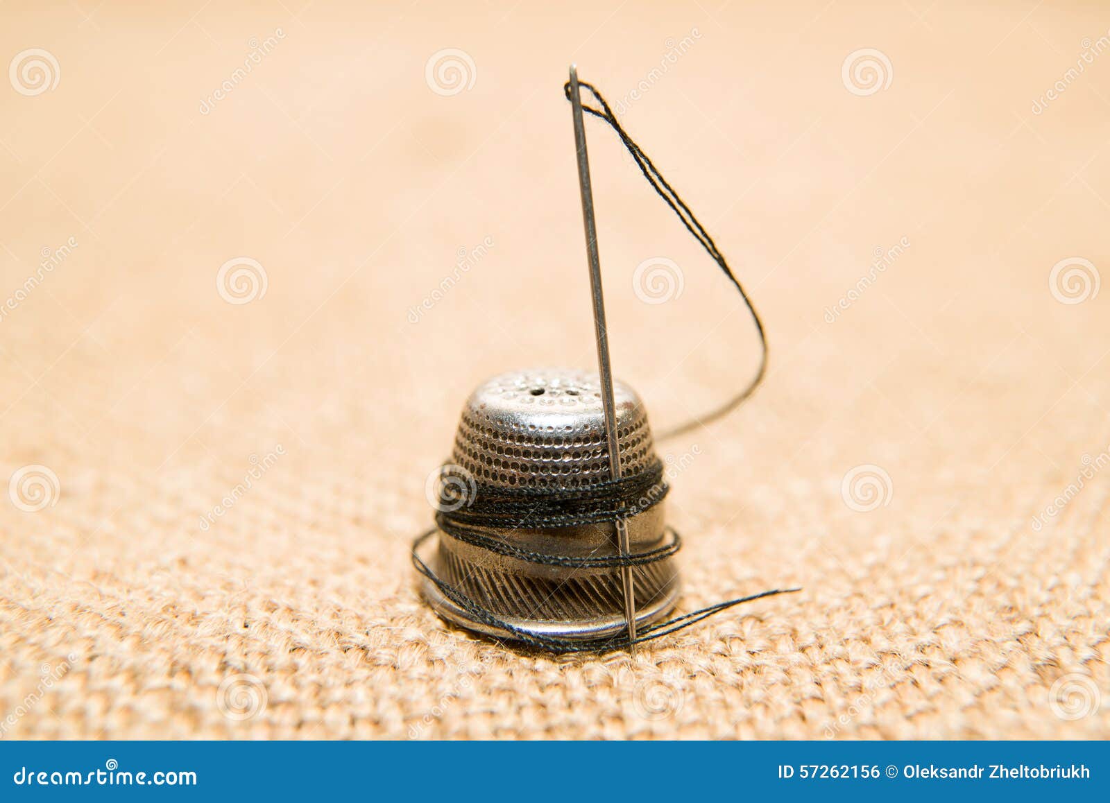 Needle and Thimble on the Old Cloth Stock Photo - Image of grain ...