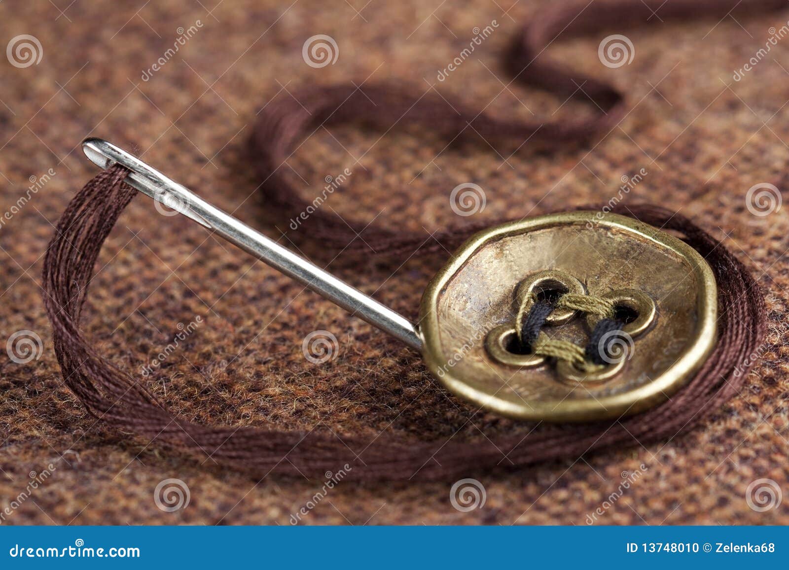 Needle with a Thread and a Button Stock Photo - Image of thread, fabric ...