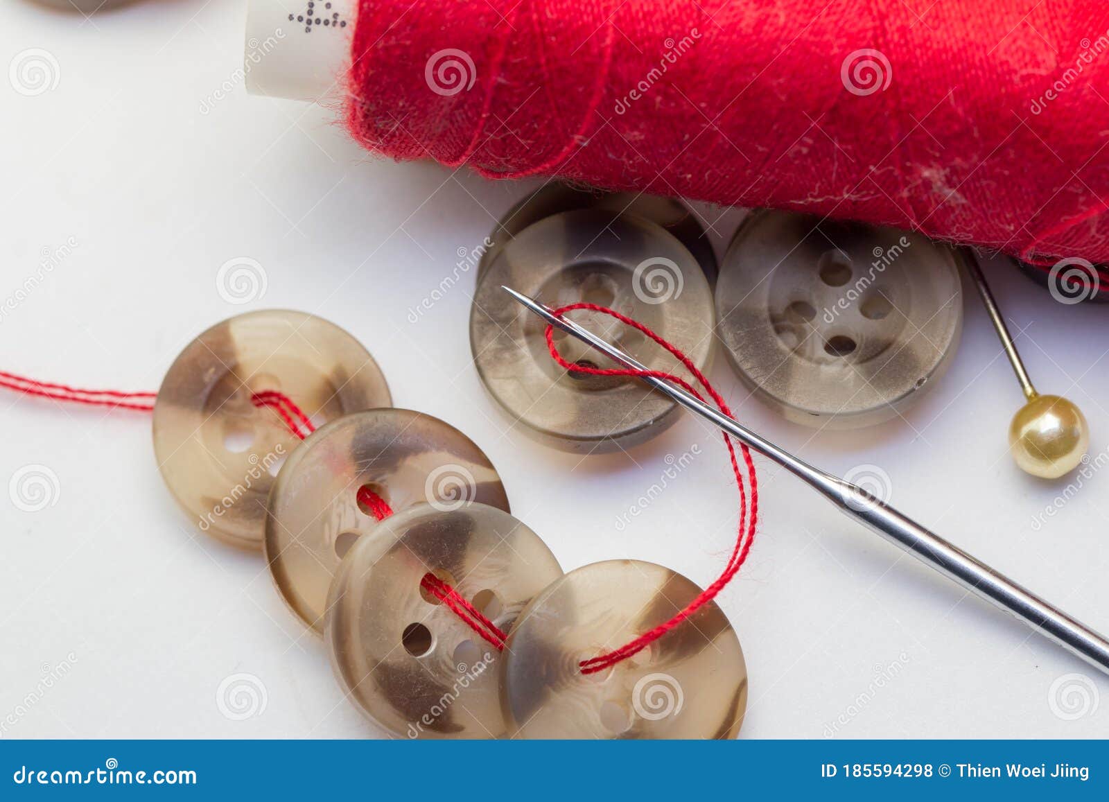 Needle with Thread and Button Isolated on White Stock Photo - Image of ...
