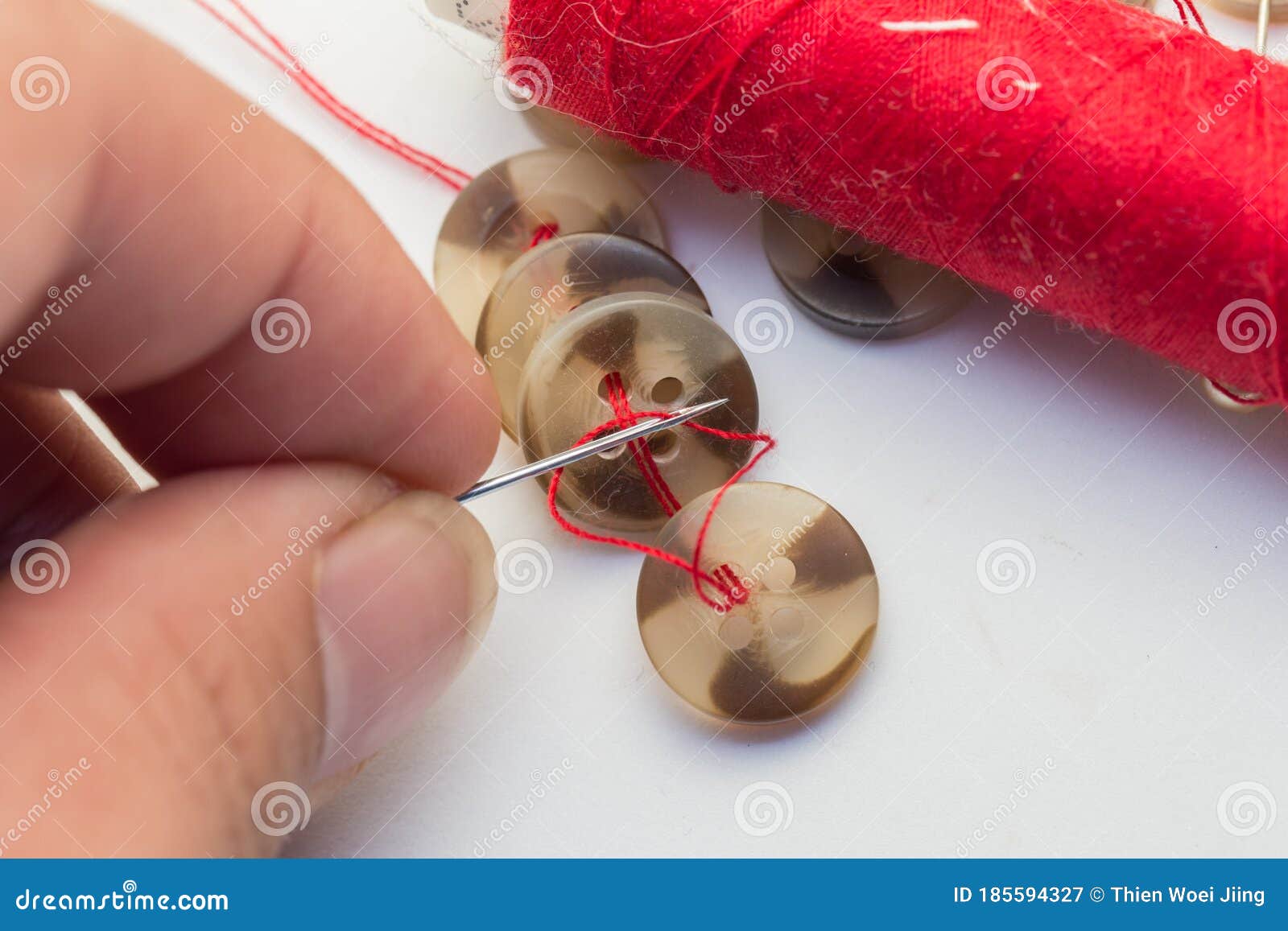 Needle with Thread and Button Isolated on White Stock Image - Image of ...