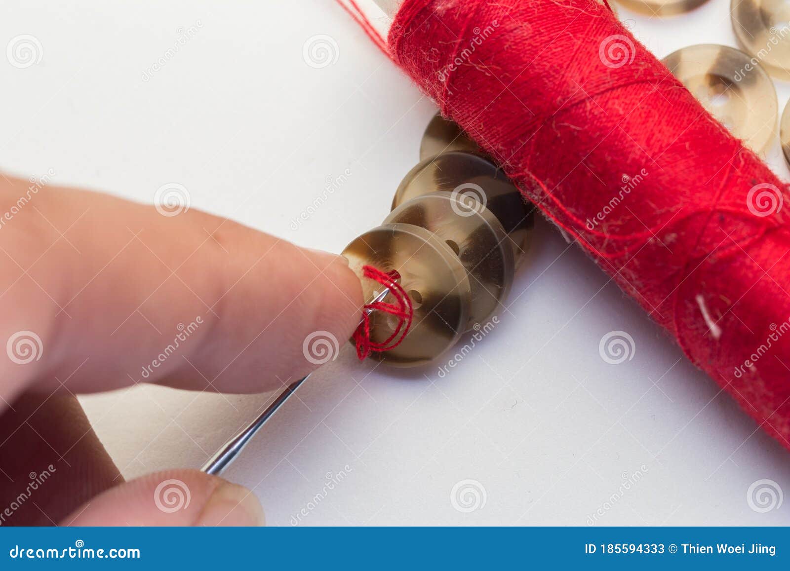 Needle with Thread and Button Isolated on White Stock Image - Image of ...