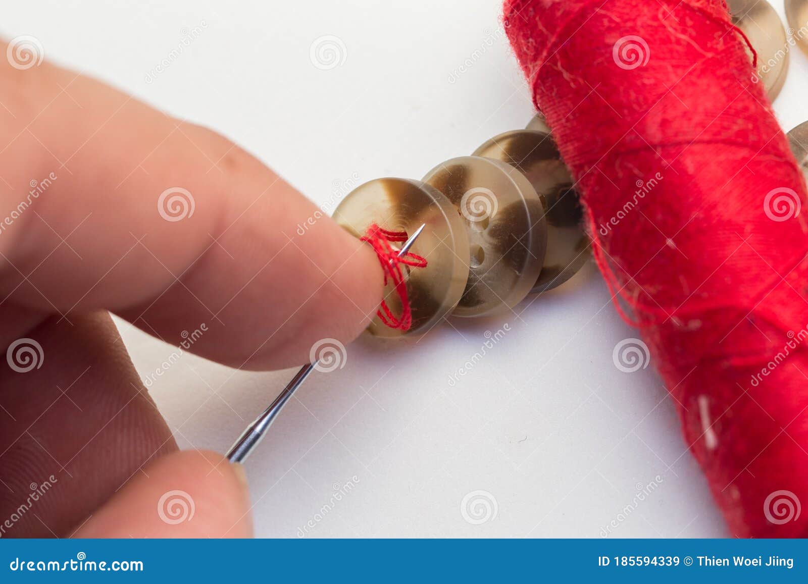 Needle with Thread and Button Isolated on White Stock Image - Image of ...