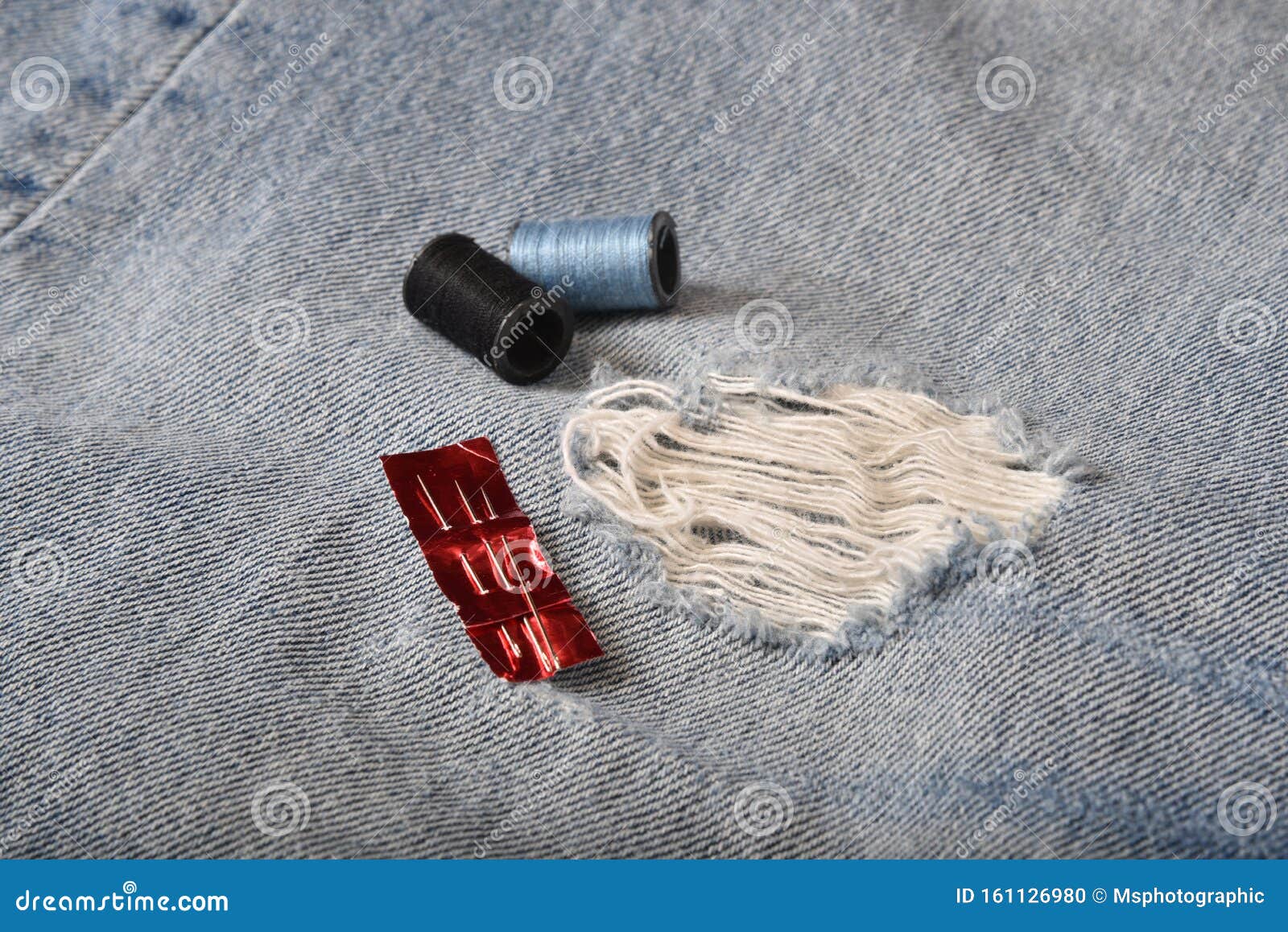 Needle and thread on jeans stock photo. Image of material - 161126980