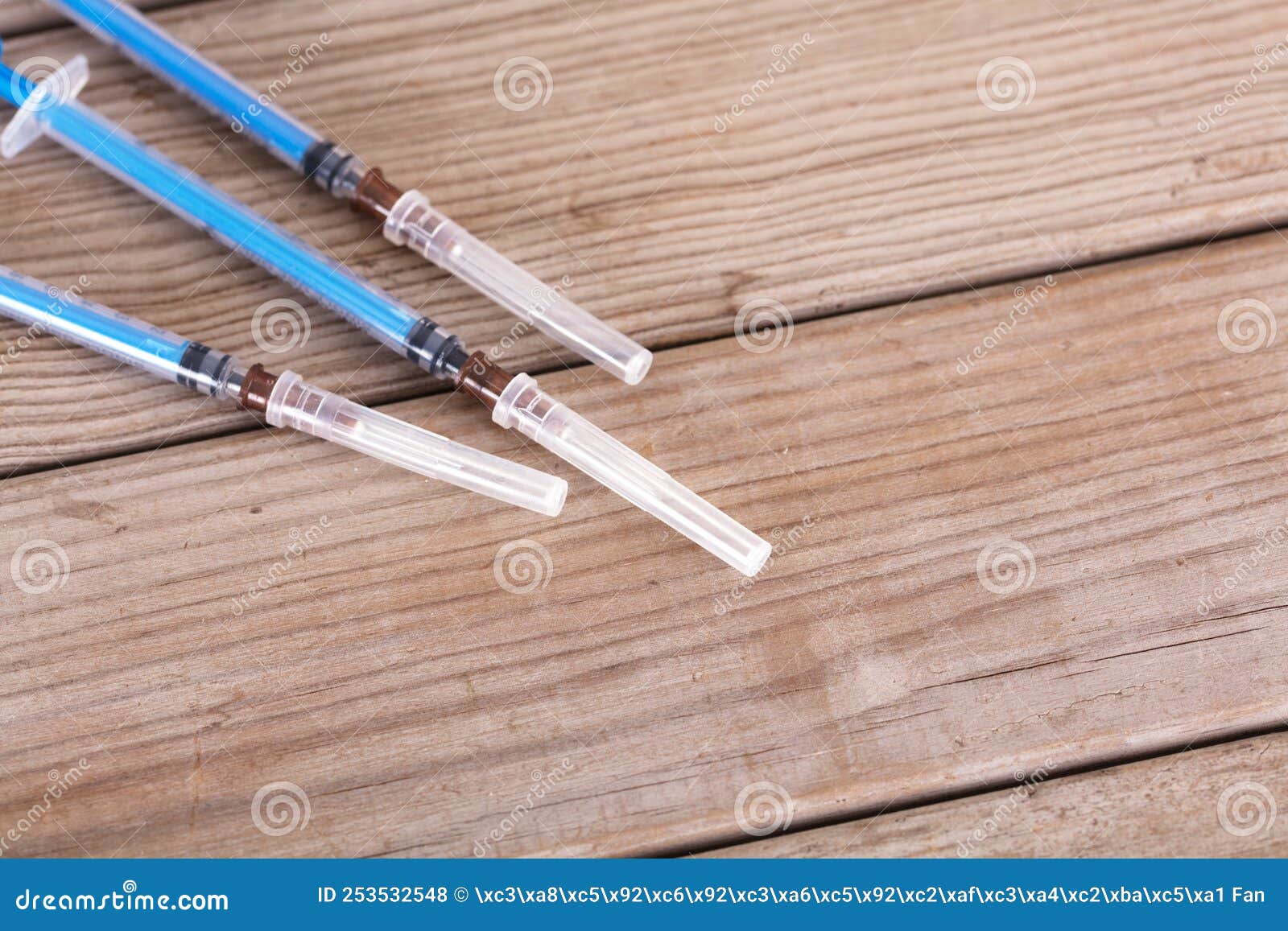 Needle Tube on Wood Grain Background Stock Photo - Image of treatment ...
