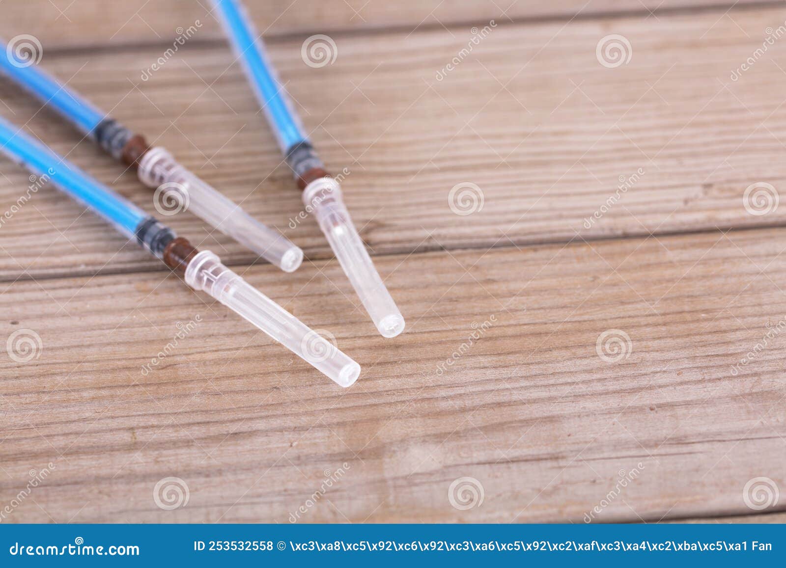 Needle Tube on Wood Grain Background Stock Photo - Image of wood ...