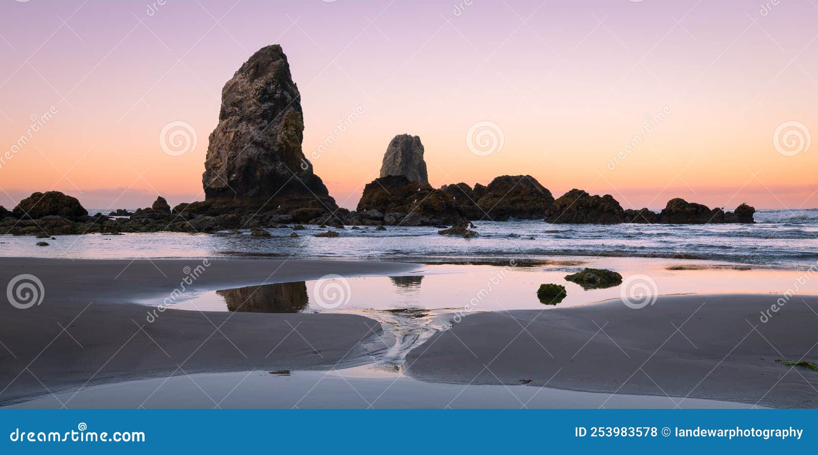 The Needles Sea Stacks Alongside the Beach at Cannon Beach Oregon Stock ...