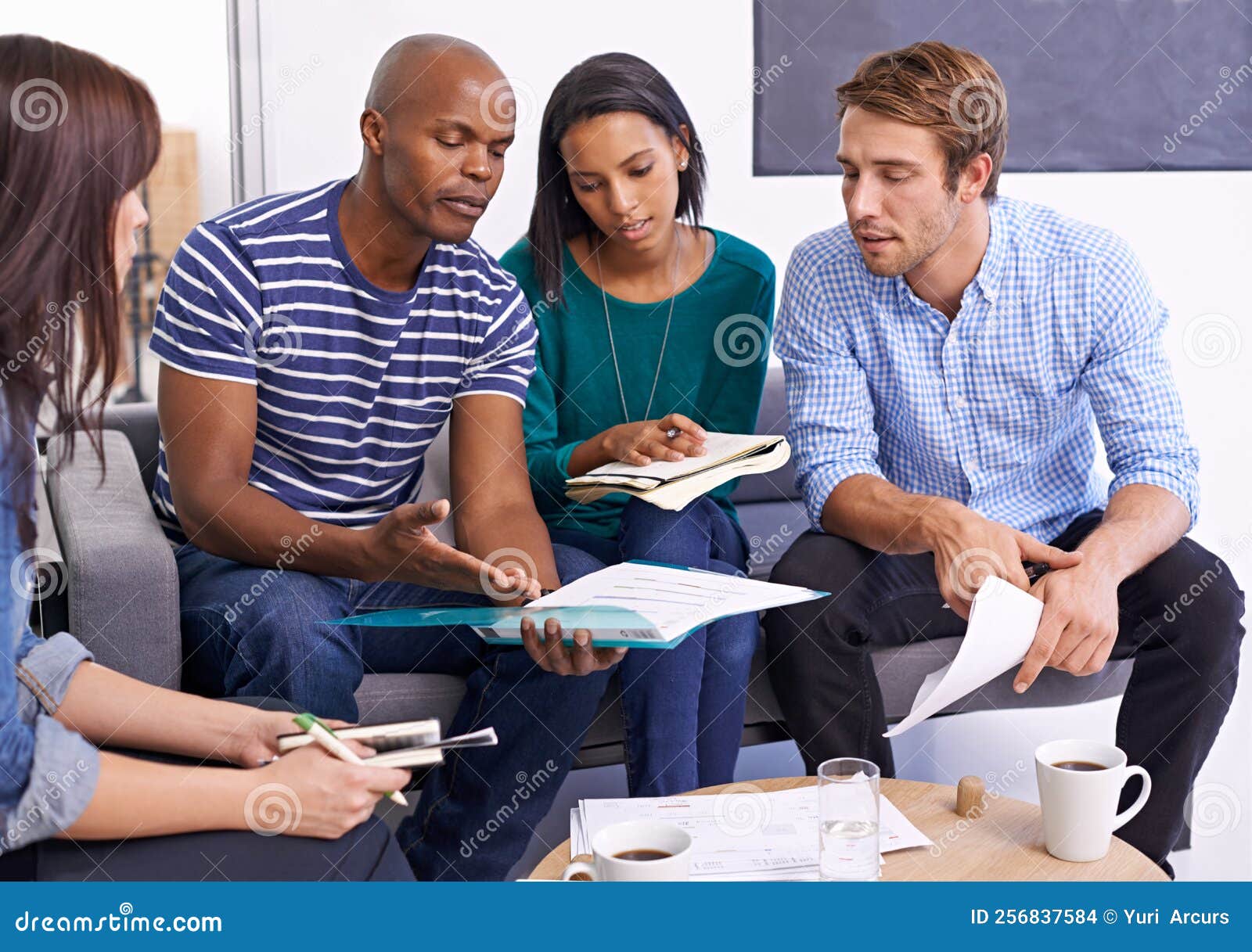 He Needs an Explanation. a Young Group of Designers Having a Discussion ...