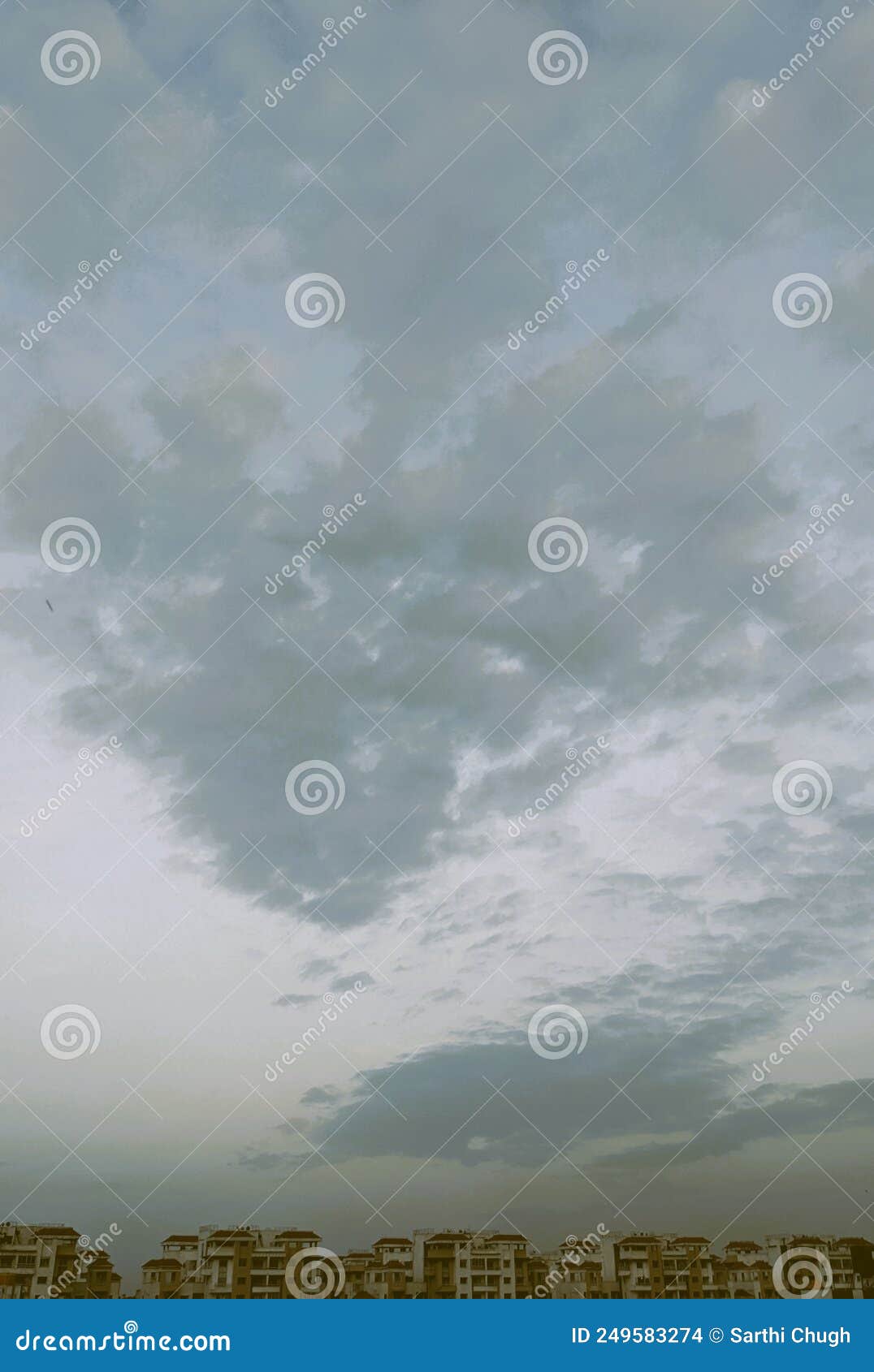 Negative Space in Clouds with Buildings in Background in Evening View ...