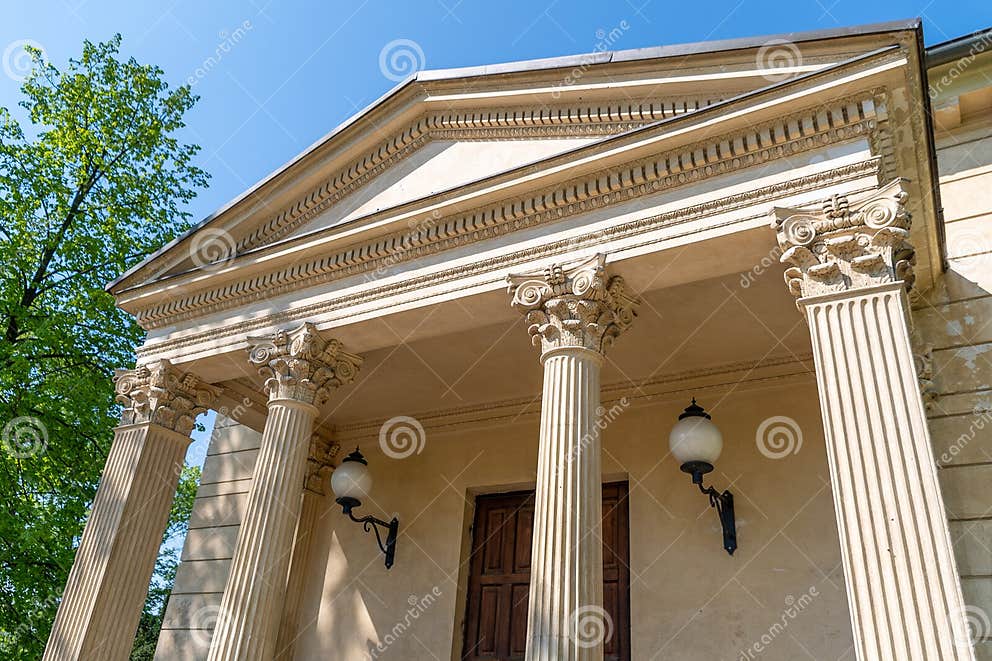 A Neoclassical Building Entrance with Corinthian Columns and a ...
