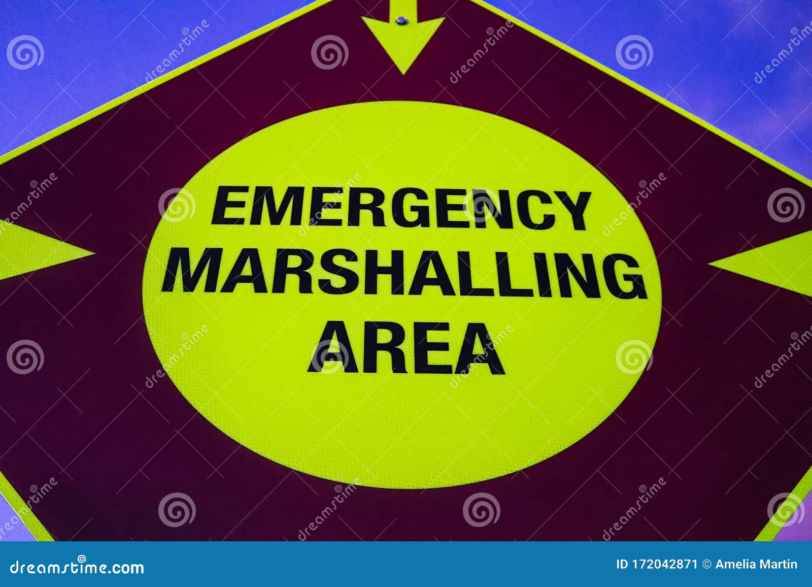 A Neon Emergency Marshalling Area Sign with Arrows Stock Image - Image ...