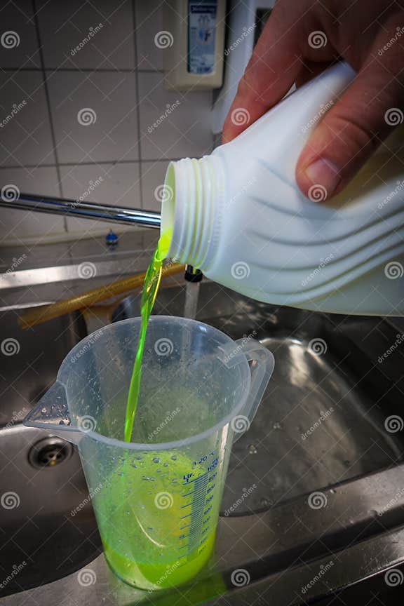 Neon Green Liquid is Put into a Water Bath Stock Photo - Image of ...