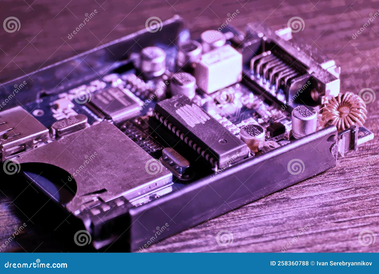 Neon Highlighted PCB with a Microchip on the Engineer Tabl Stock Photo ...