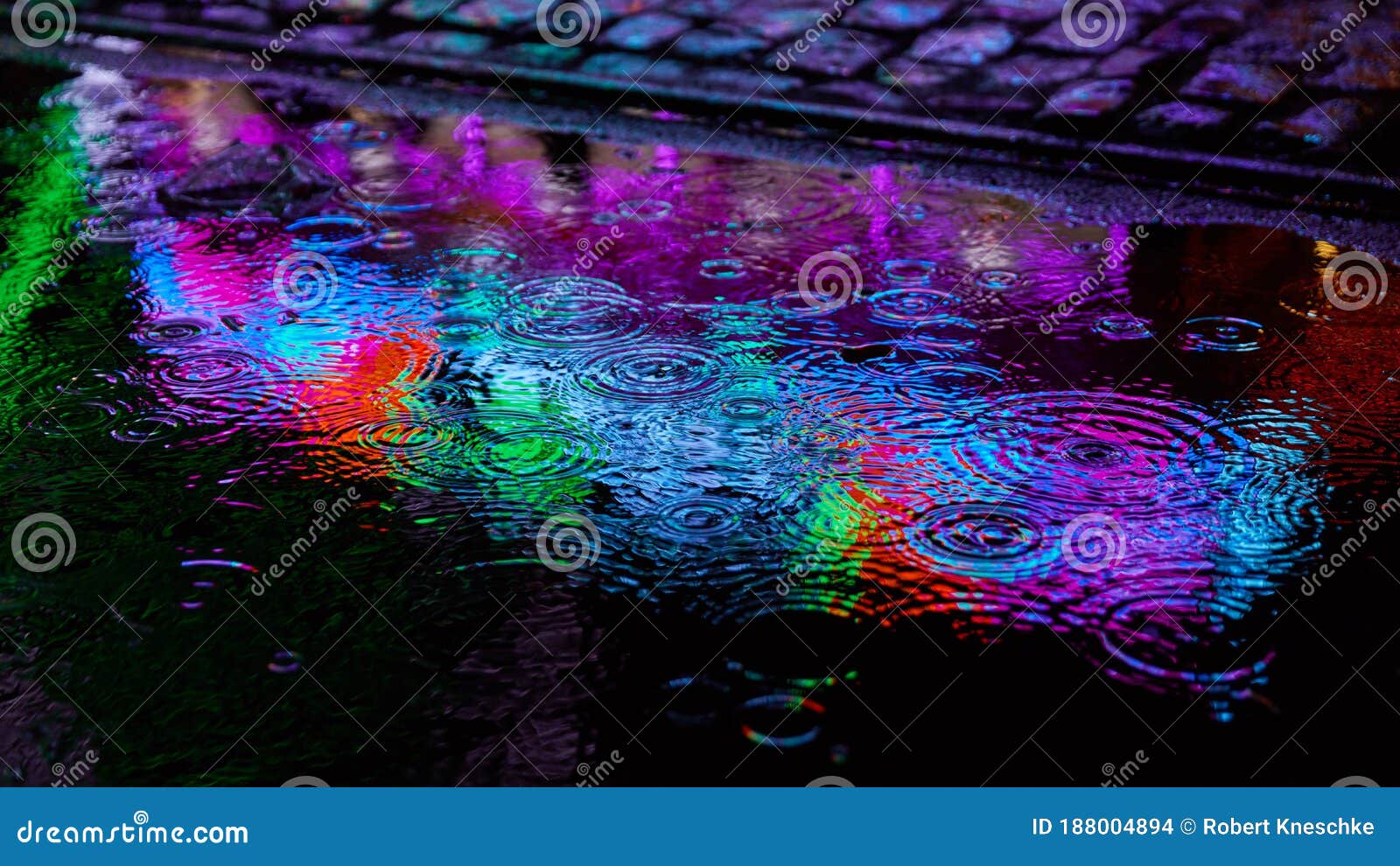 Neon Light As a Reflection in the Water of a Puddle when it Rains Stock ...