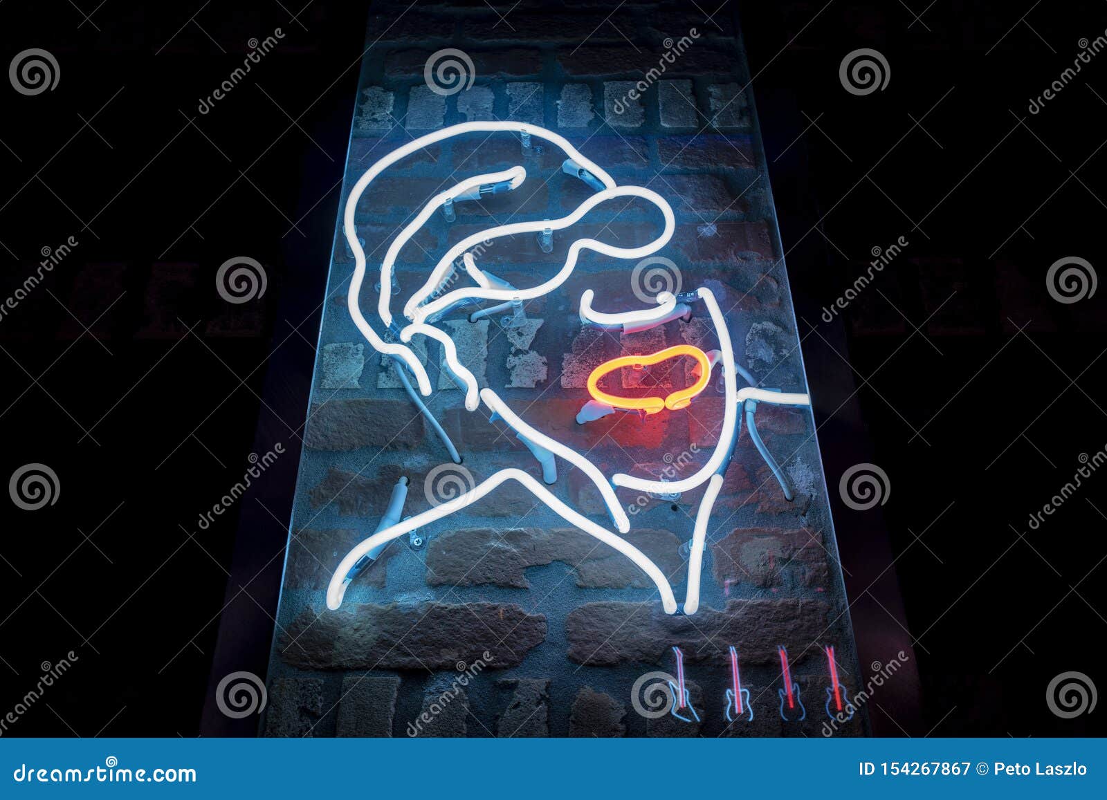 Neon Light in Shape of a Man in a Rock Bar As Decoration Editorial ...