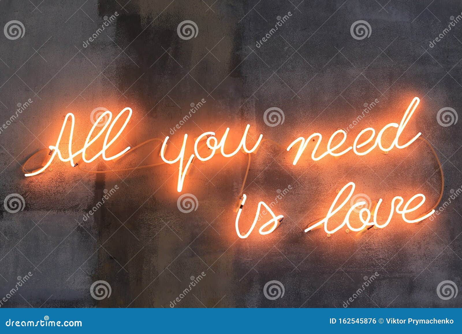 Lighting Words All You Need is Love on the Wall Stock Photo - Image of ...