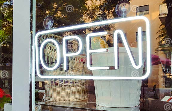 Neon Open Sign Illuminated in a Window of a Store Stock Image - Image ...