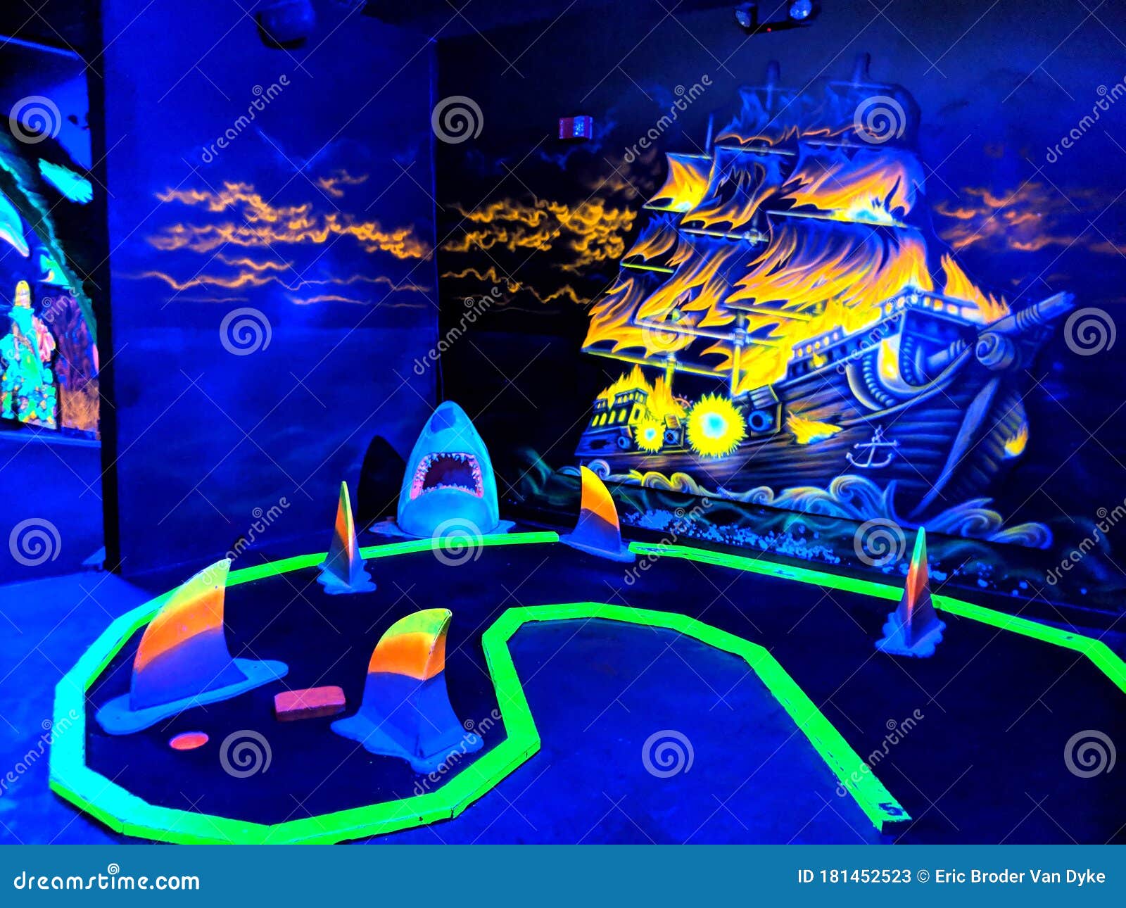 Neon Pirate Ship and Shark Mini Golf Course Stock Image - Image of ...