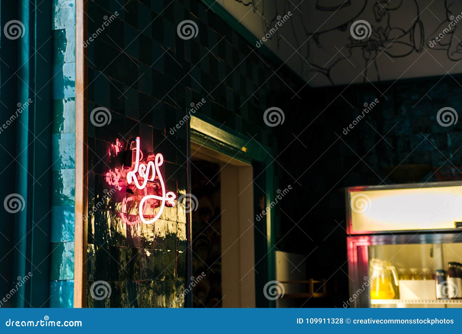 Less Neon Sign Mounted On Glass Board Near Open Window And Glass ...
