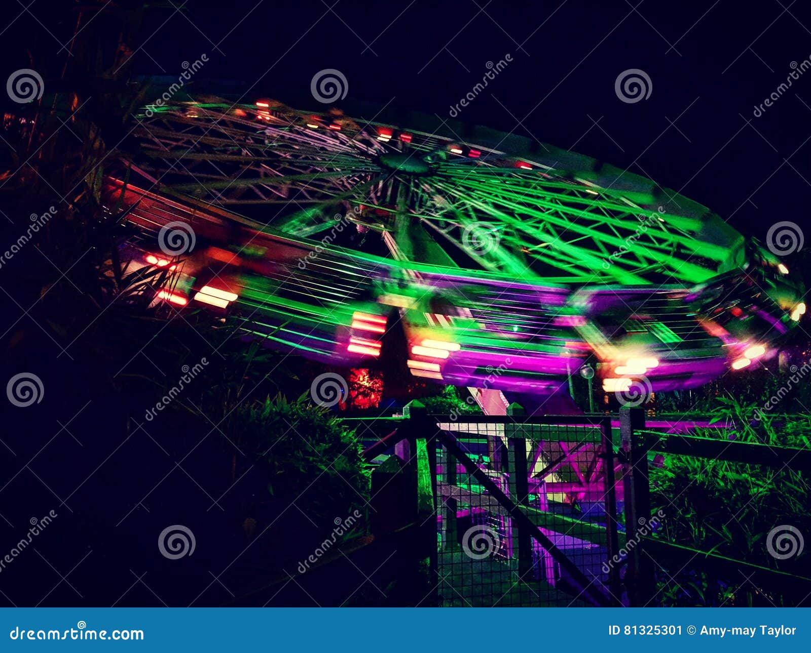 Neon Spinning Theme Park Ride Stock Image - Image of ride, rainbow ...