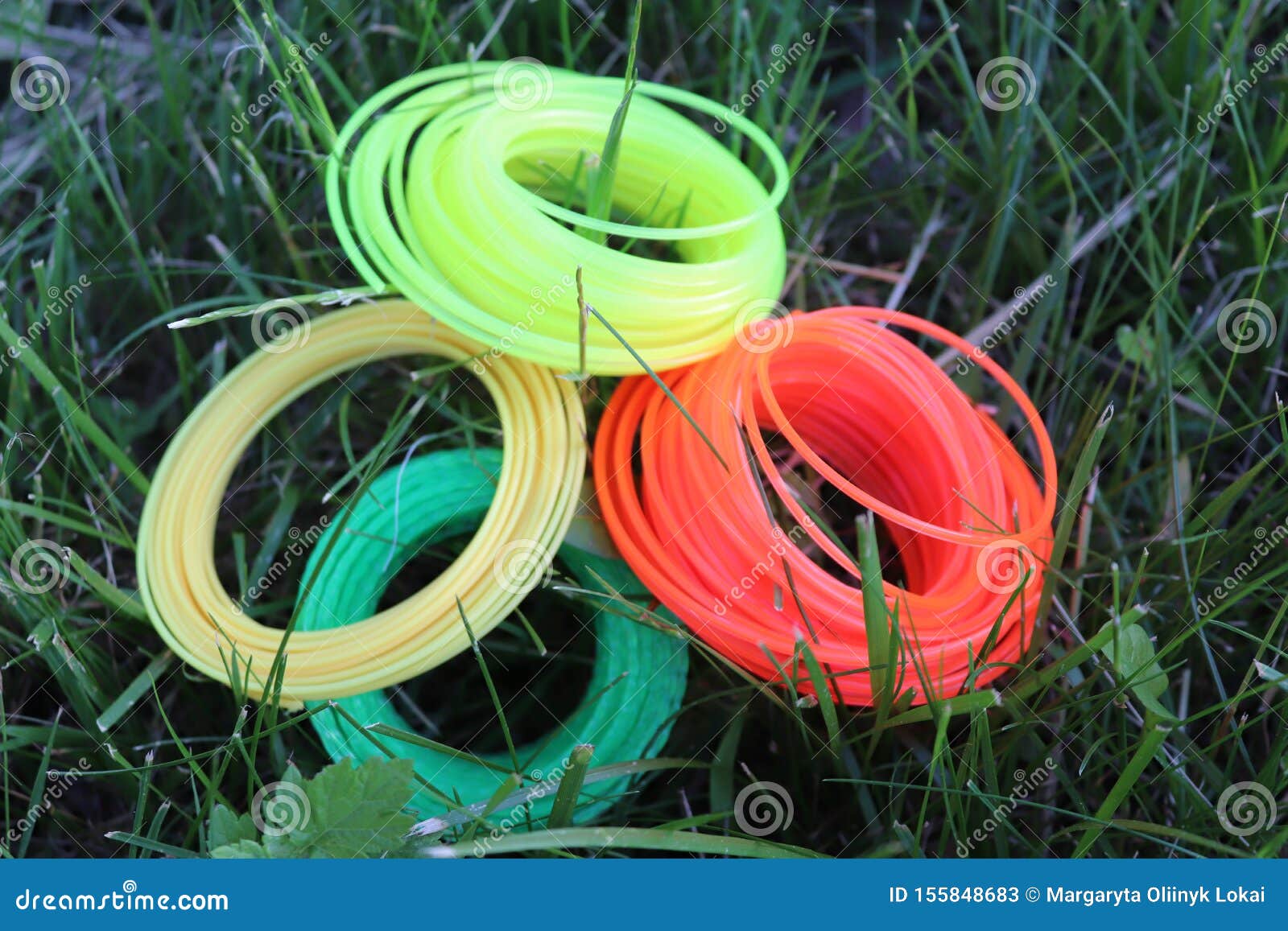 Neon Strings for Grass Trimmer on the Grass Stock Image - Image of ...
