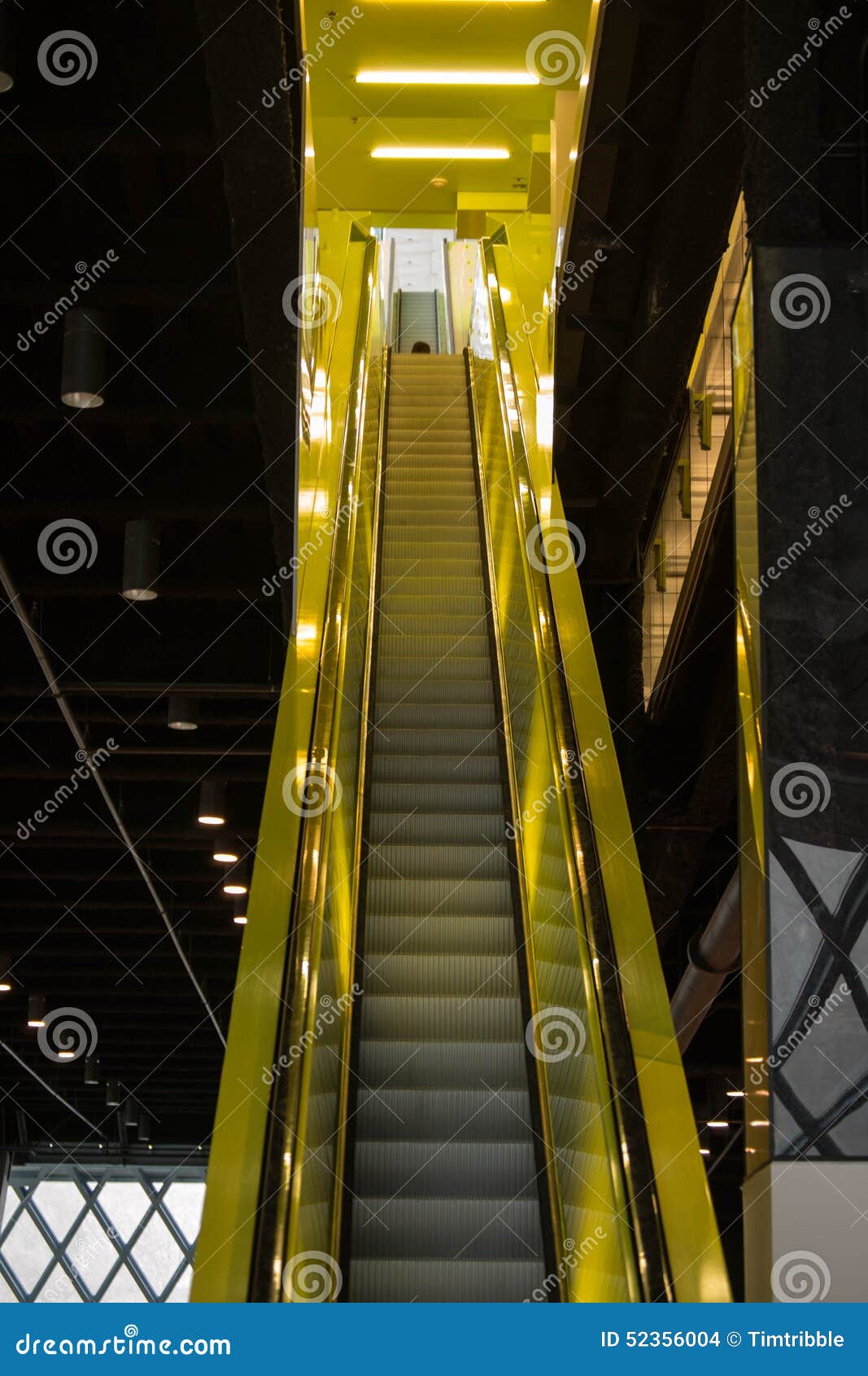 Neon yellow escalator stock photo. Image of architecture - 52356004