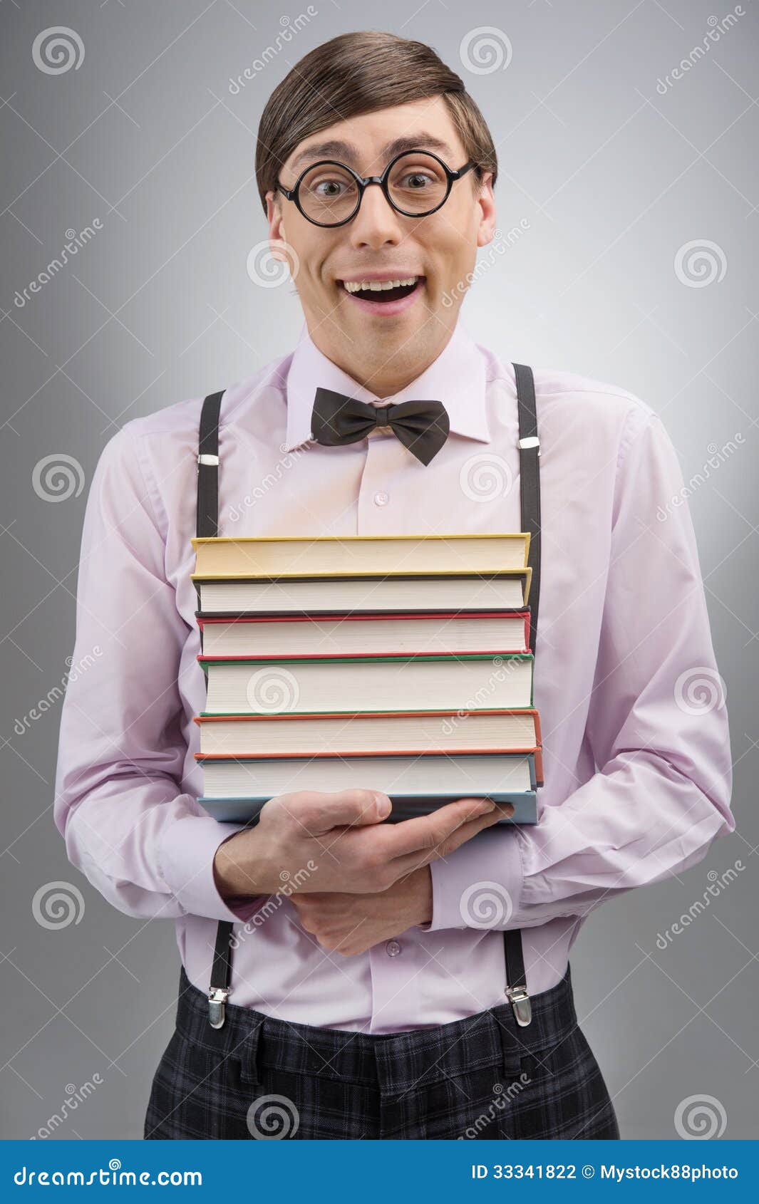 Nerd with Book Stack. Young Nerd Man Holding a Book Stack while Stock ...