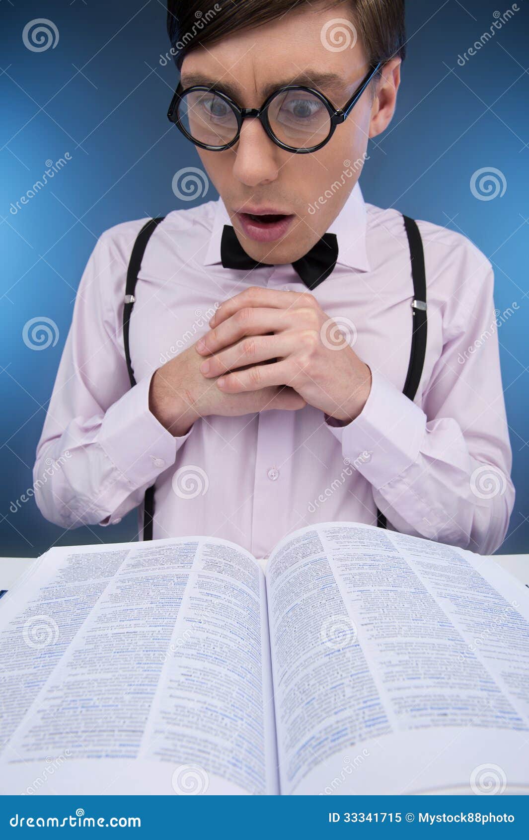 Nerd with book. stock image. Image of serious, holding - 33341715