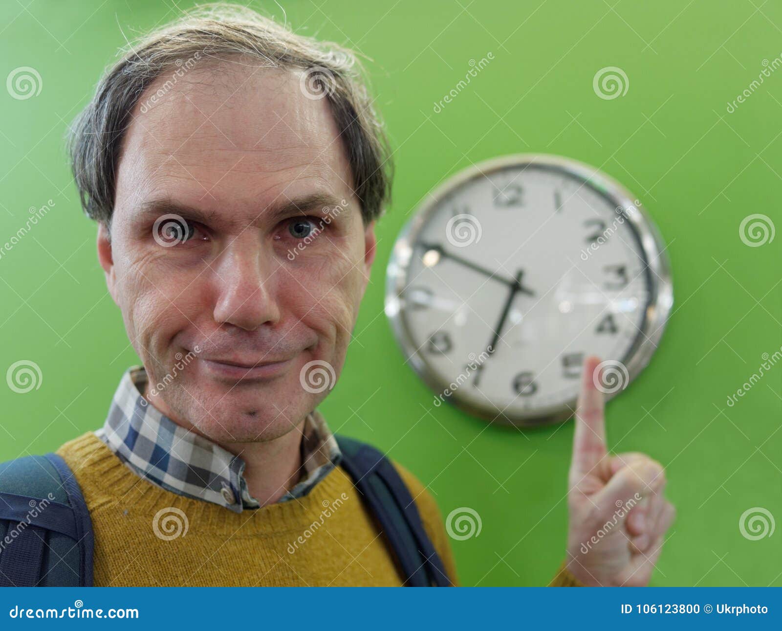 Nerd at a clock stock photo. Image of work, clock, male - 106123800