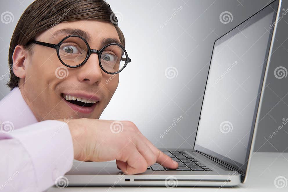 Nerd at the Computer. Side View of Young Nerd Man Working at the Stock ...