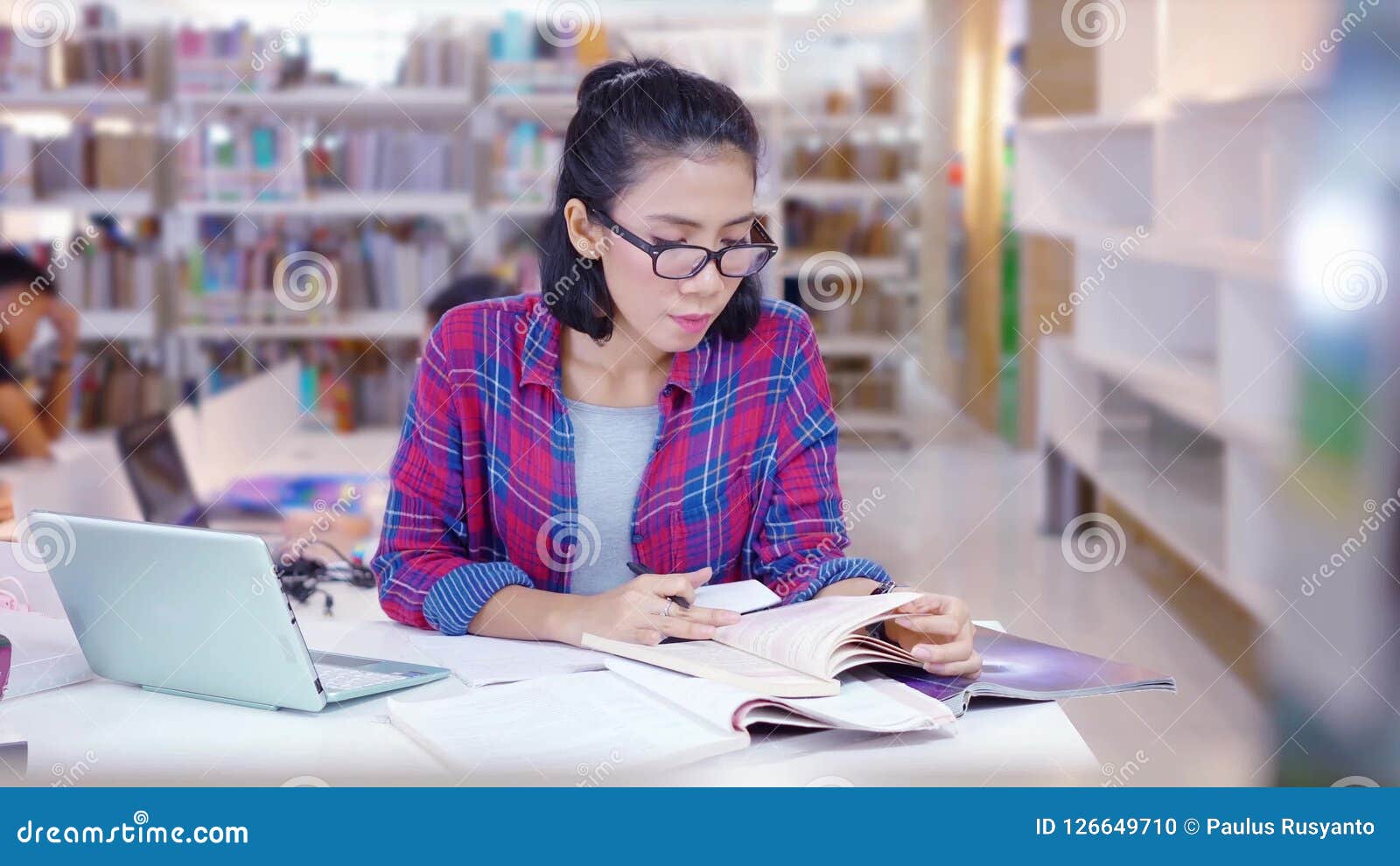 Nerd Student Learns and Read Books in Library Stock Footage - Video of ...