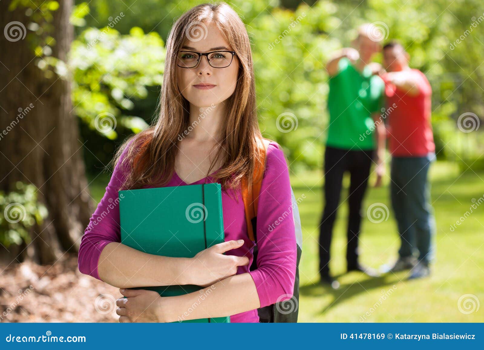 Nerdy Teenage Girl Studying With Textbooks Stock Photo