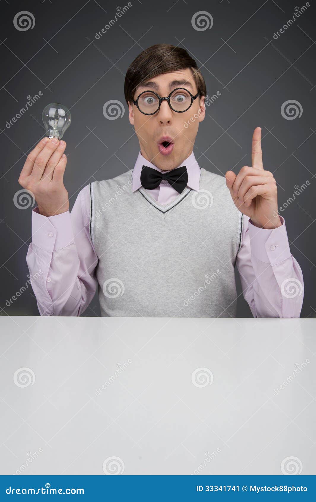 Nerd with light bulb. stock image. Image of adult, looking - 33341741