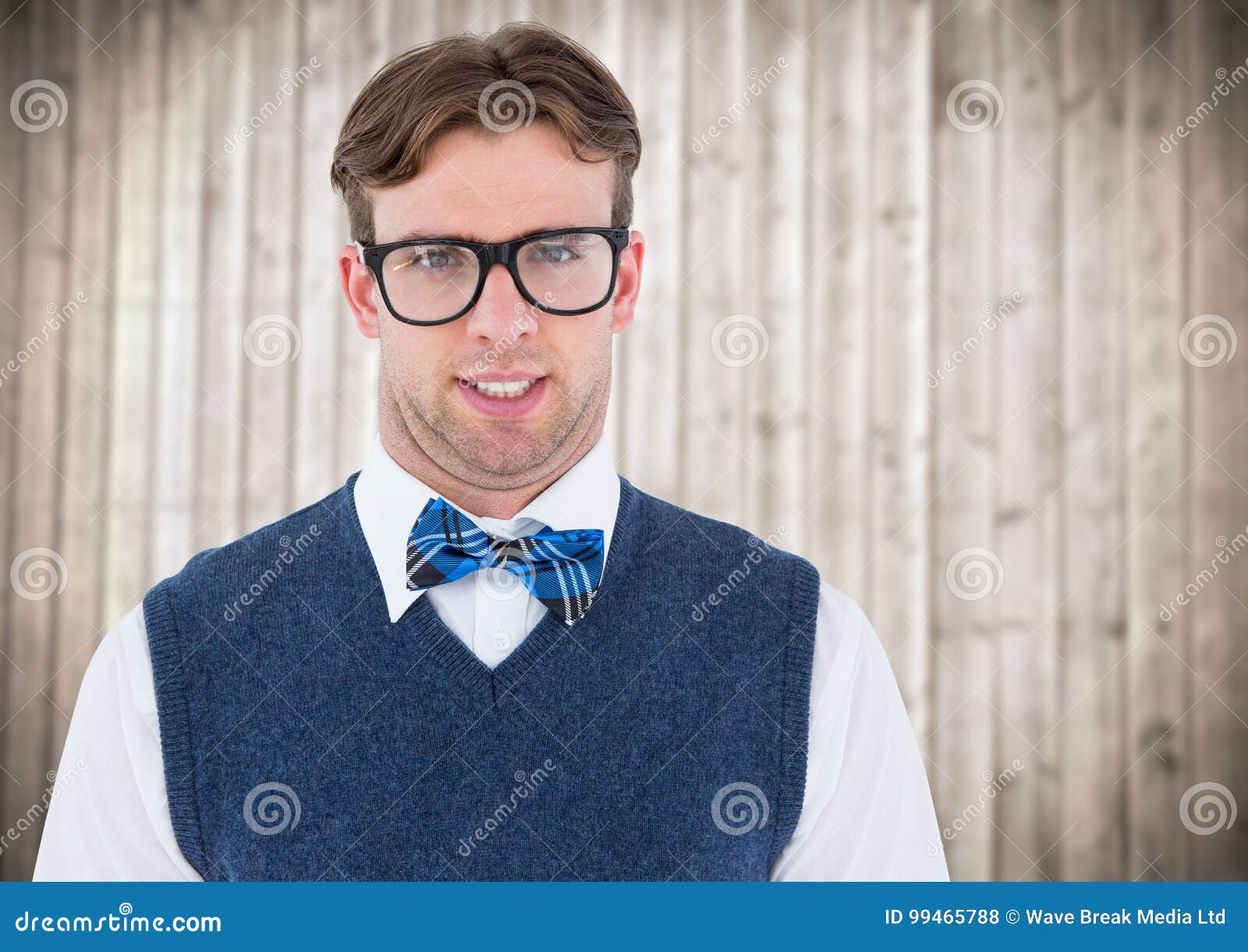 Nerd Man in Blue Vest Against Blurry Wood Panel Stock Photo - Image of ...
